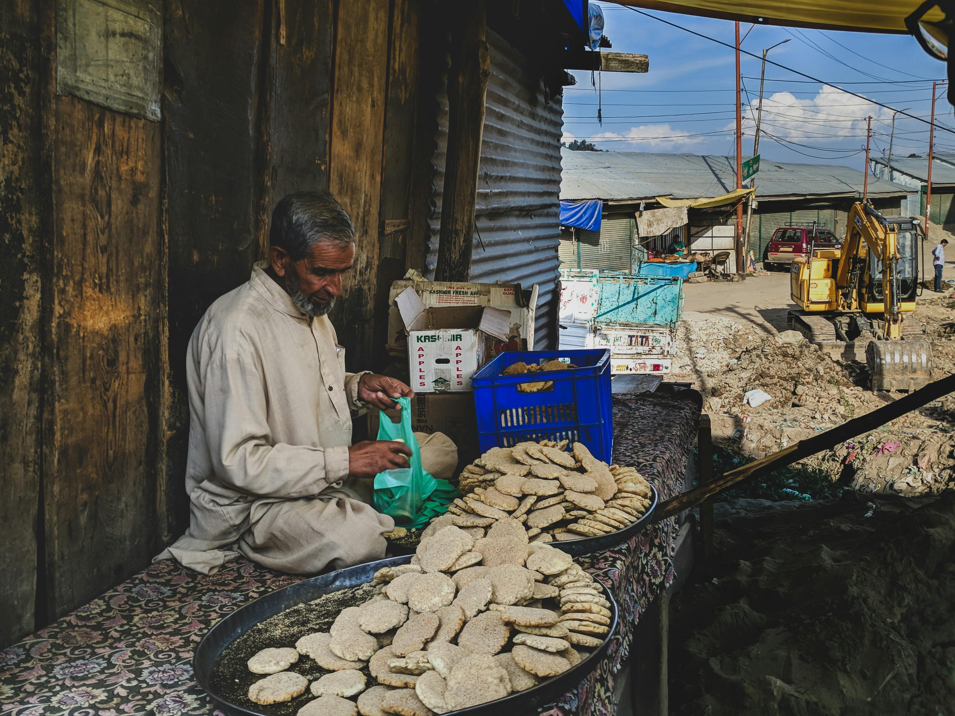 Merchant Selling Traditional Bread · Free Stock Photo
