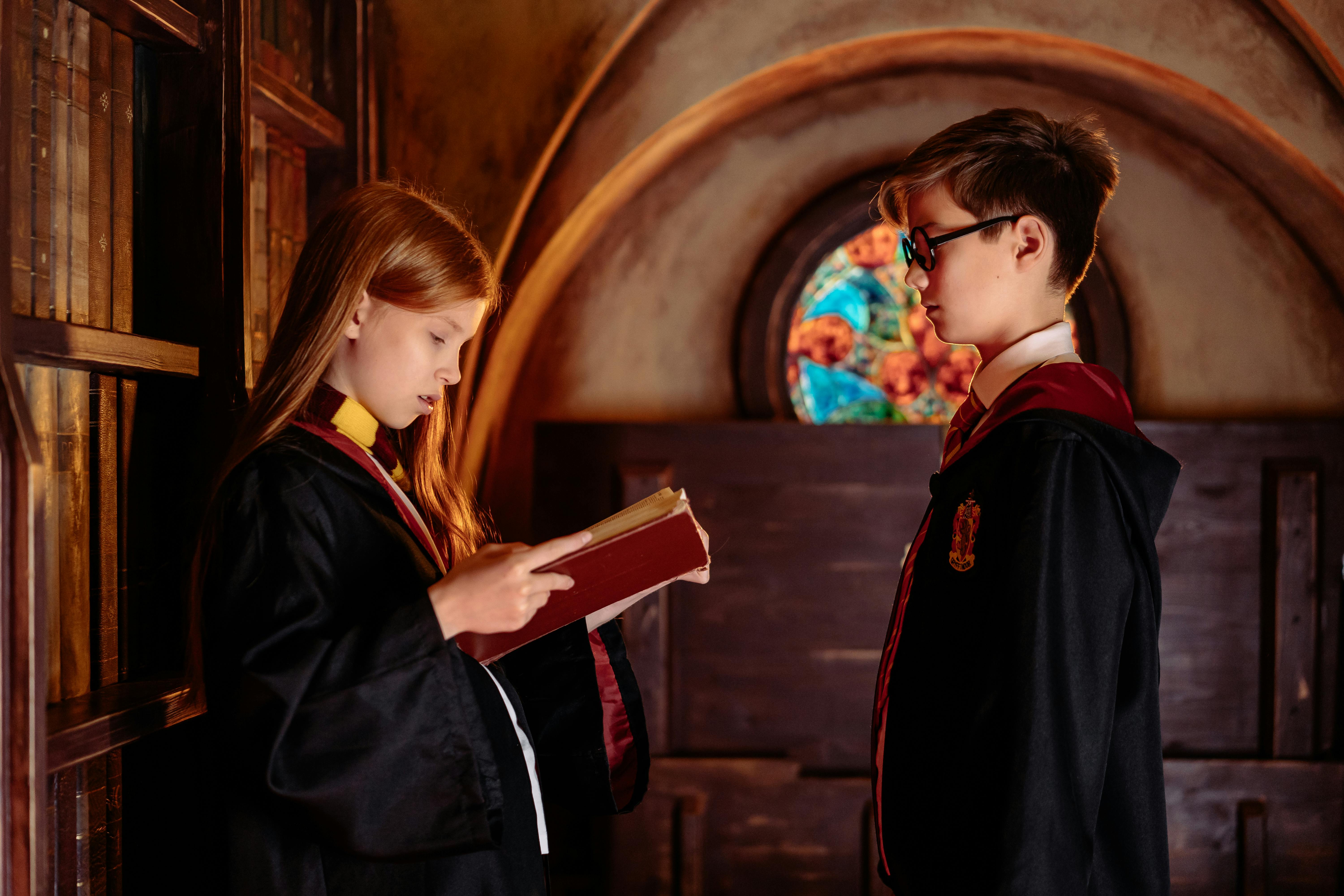 Hermione Reading Spellbook to Harry Potter · Free Stock Photo