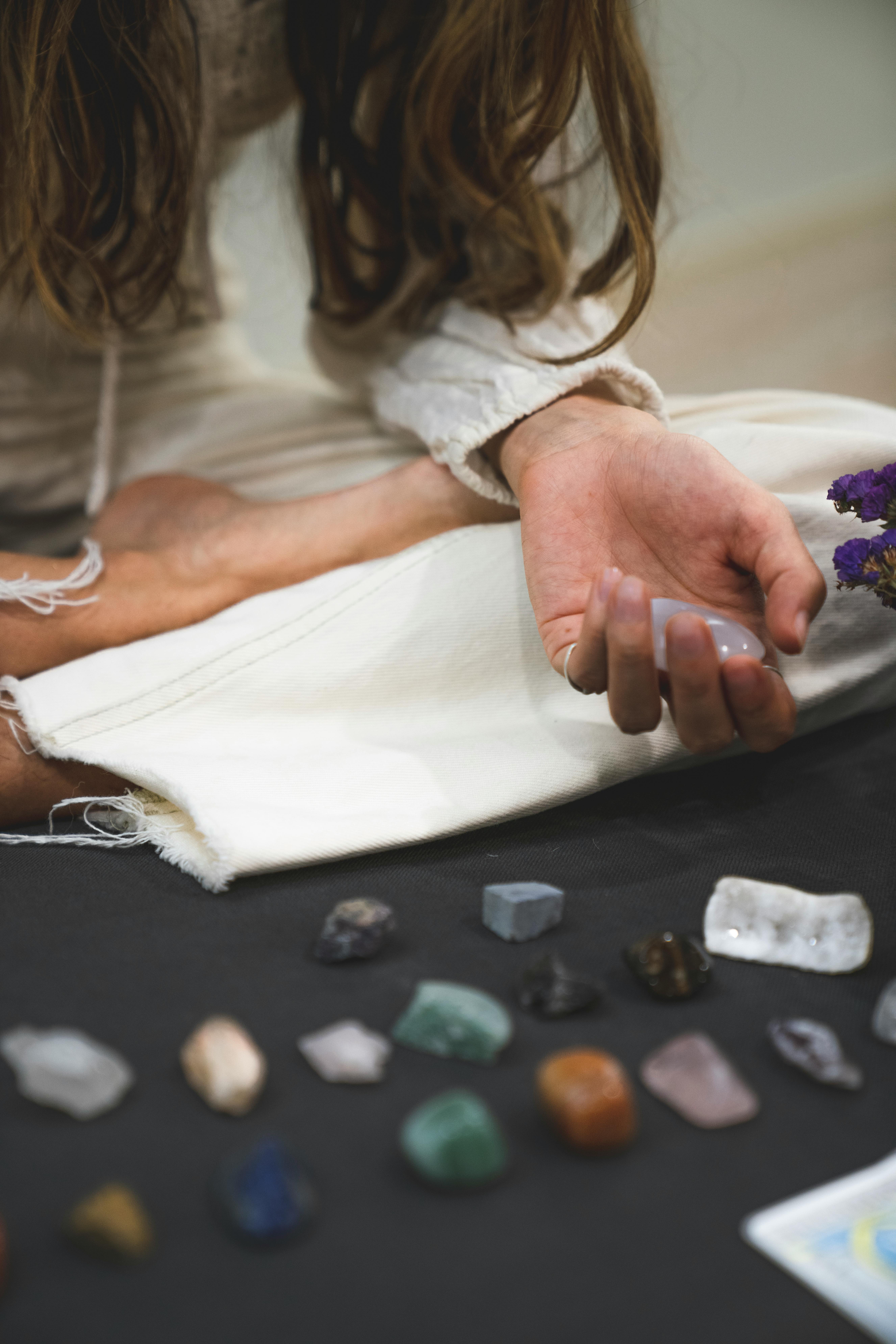 Person Holding Crystal Stones · Free Stock Photo