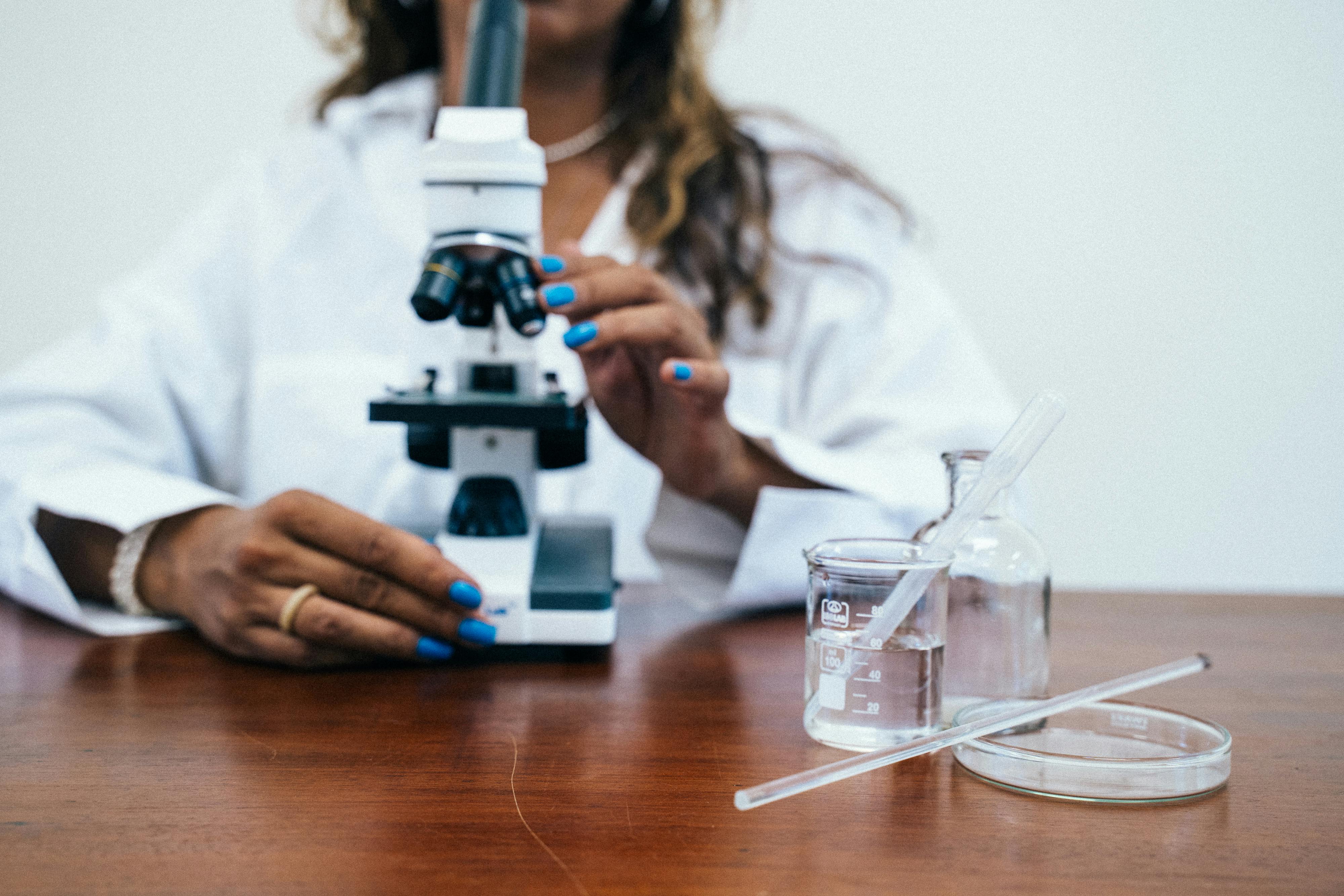 A Woman Using Microscope · Free Stock Photo