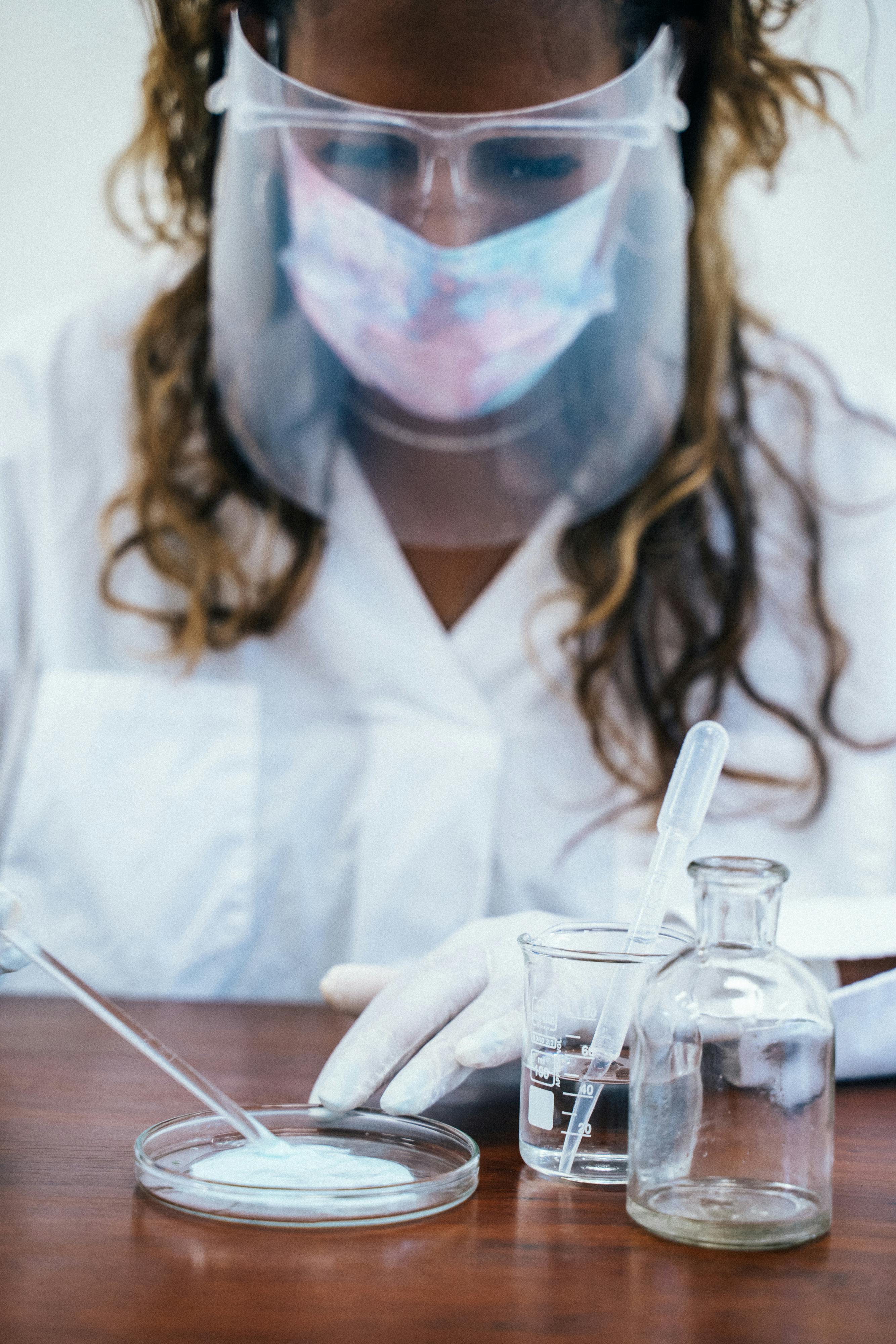 A Woman Experimenting in the Lab · Free Stock Photo