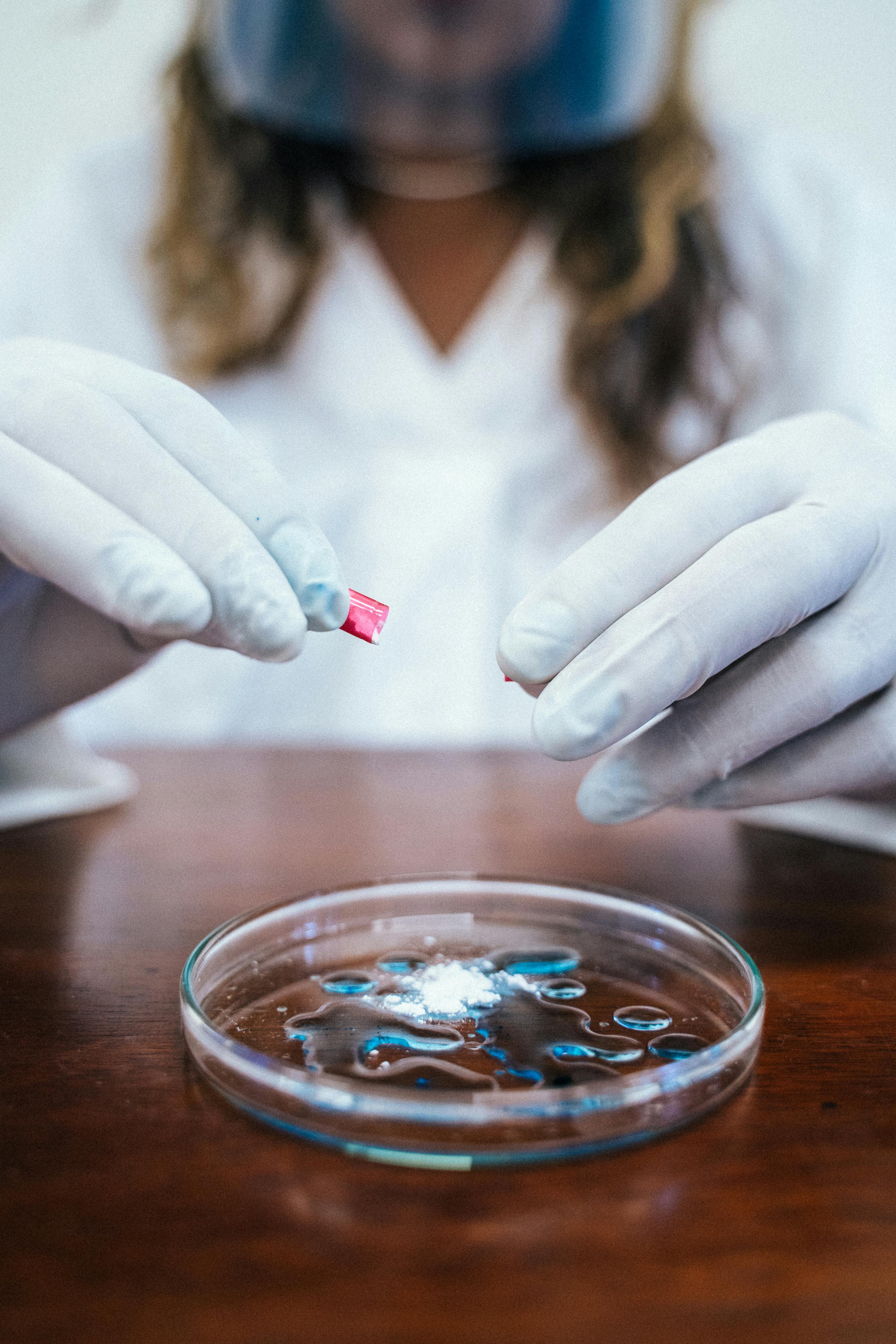 Person Putting Powder on Liquid · Free Stock Photo