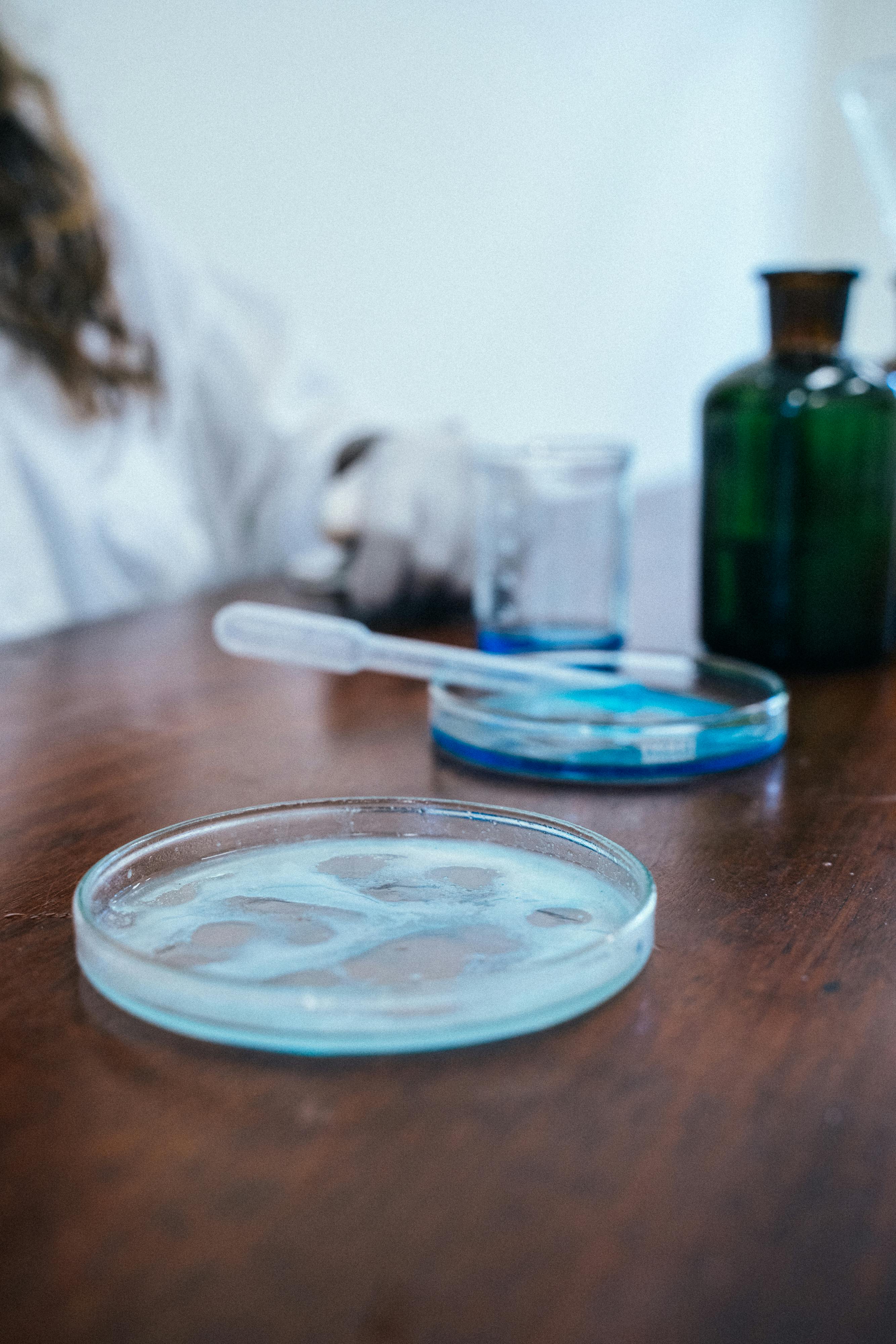 A Person in a Cleanroom Suit Holding Laboratory Glassware · Free Stock ...
