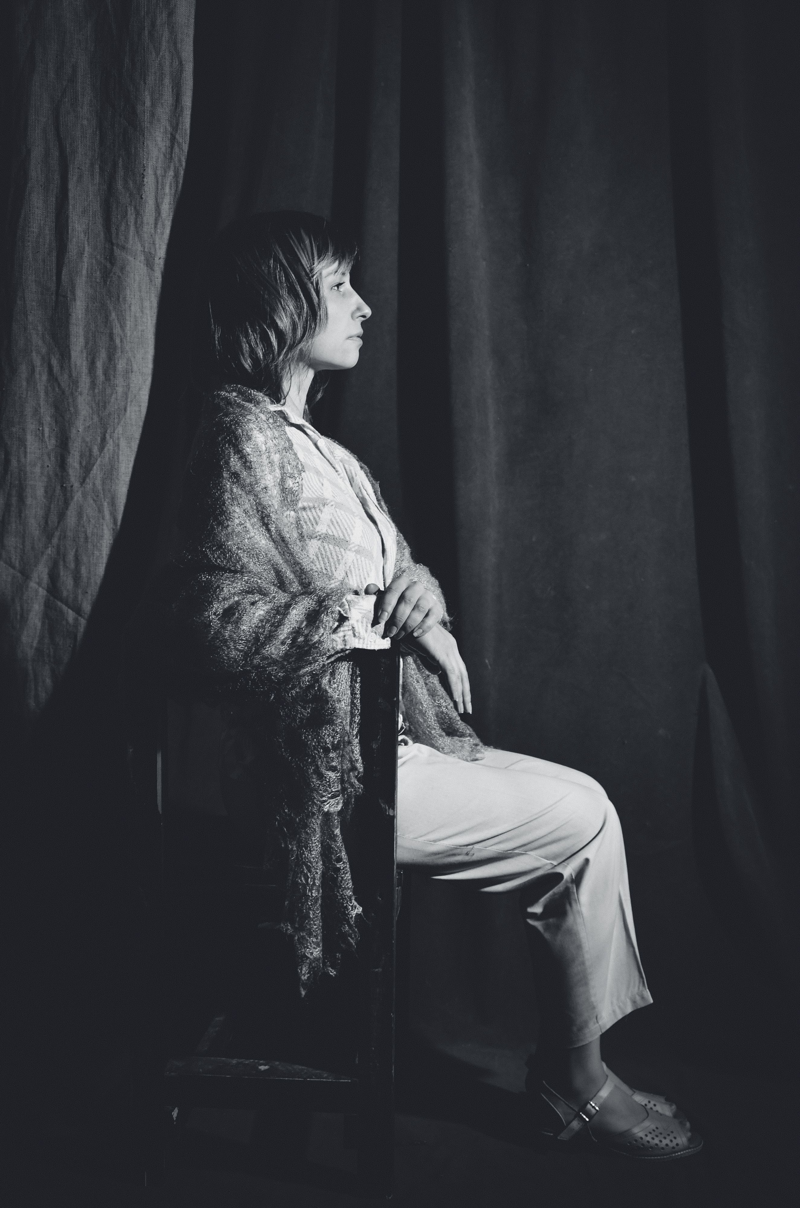 Black-and-White Photography of a Person Sitting on a Chair · Free Stock ...