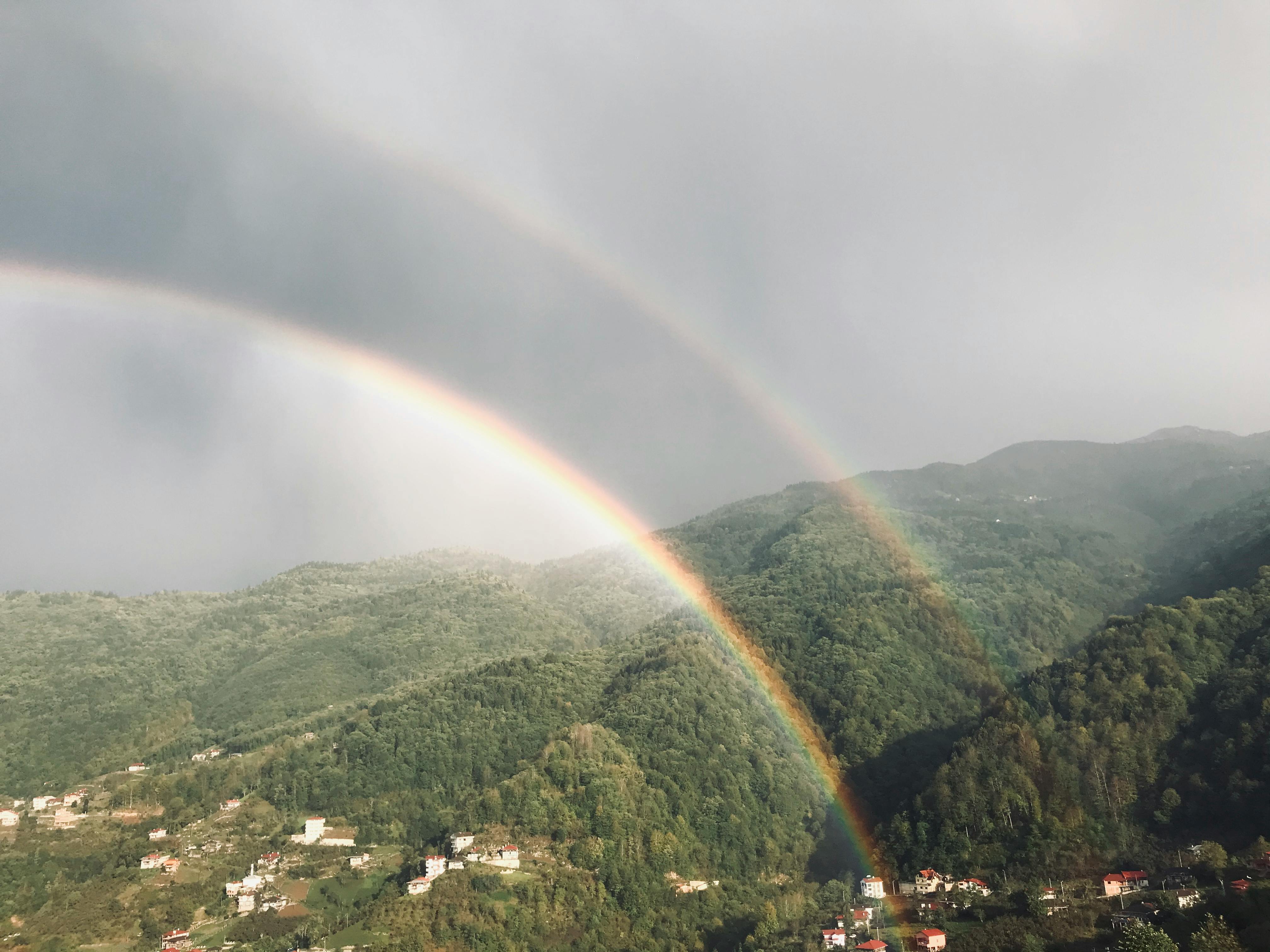 Rainbows above Hills · Free Stock Photo