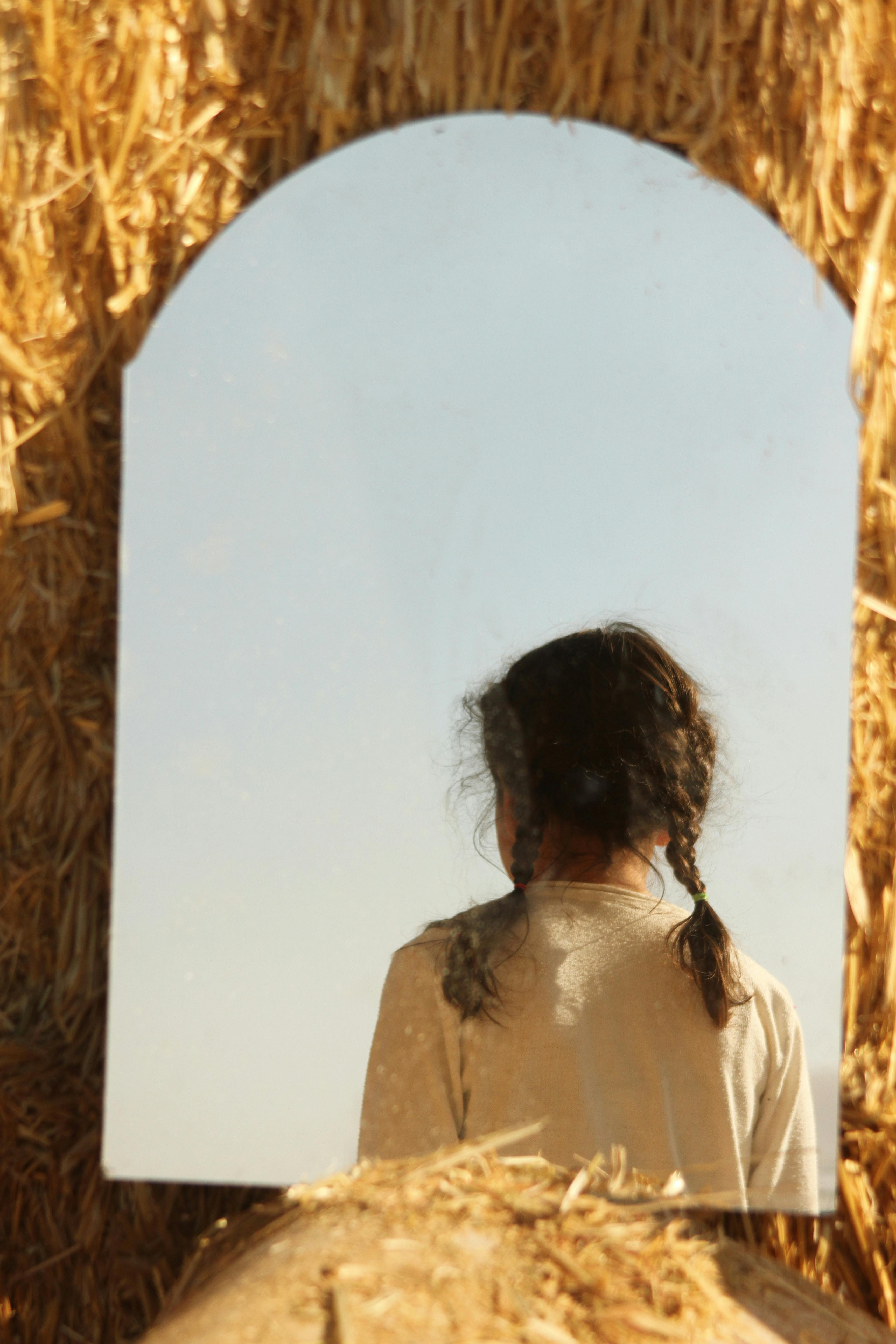 Man Touching Reflection in Mirror · Free Stock Photo