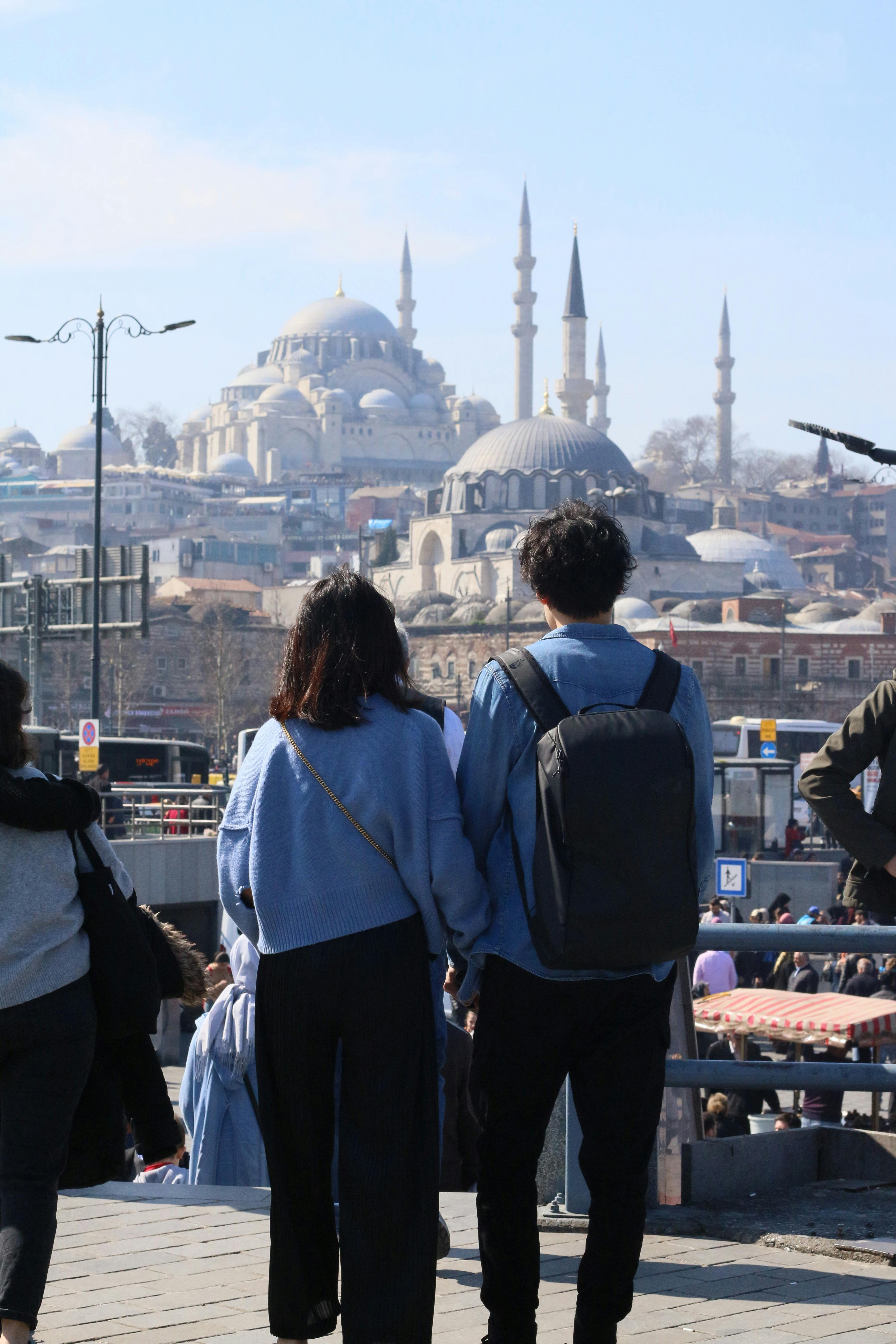 Back View of Tourists Looking at Heritage Architecture · Free Stock Photo