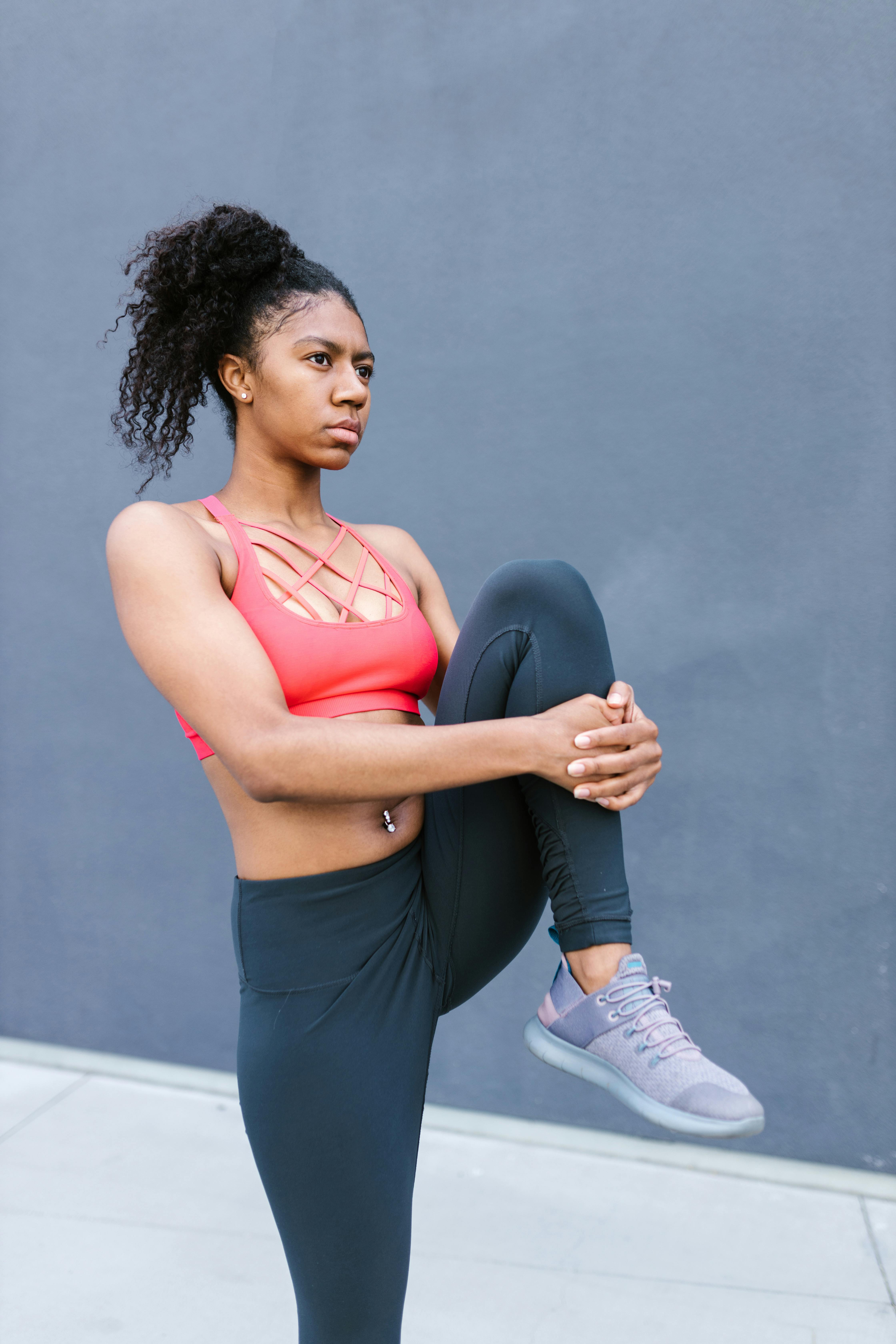 Fit Woman doing Stretching Exercises · Free Stock Photo
