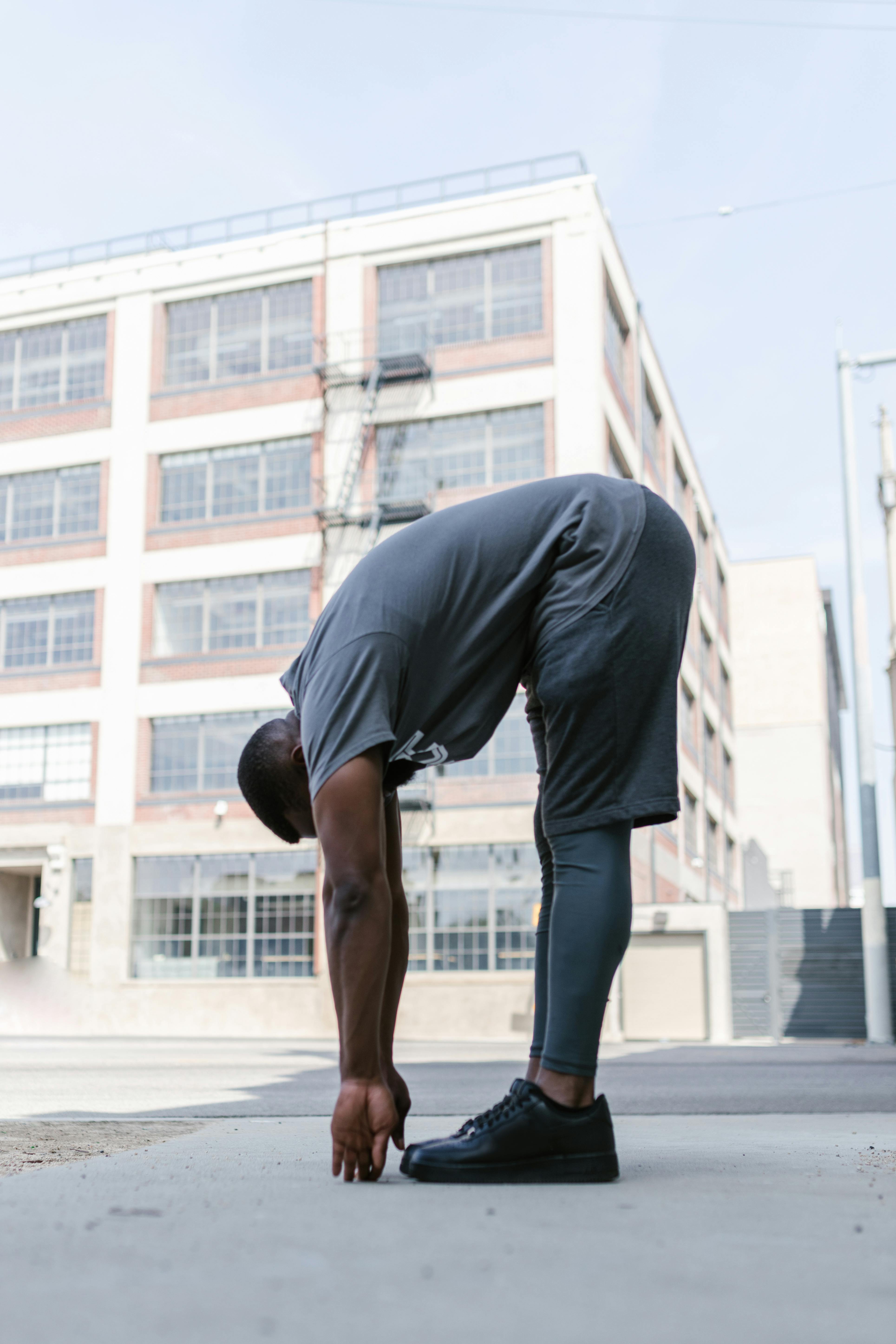 Photo of a Man Stretching · Free Stock Photo
