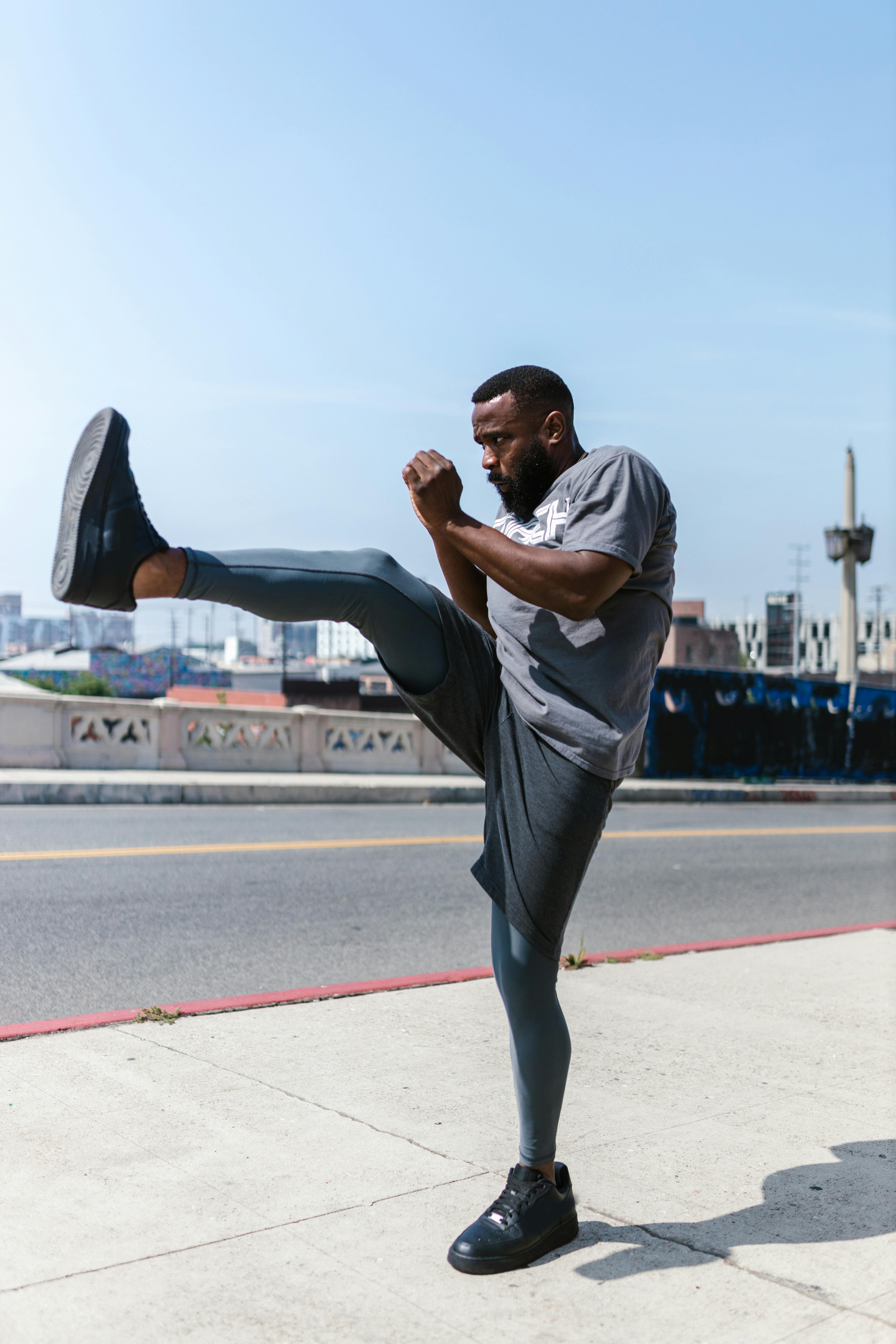 Man Kicking on Street · Free Stock Photo