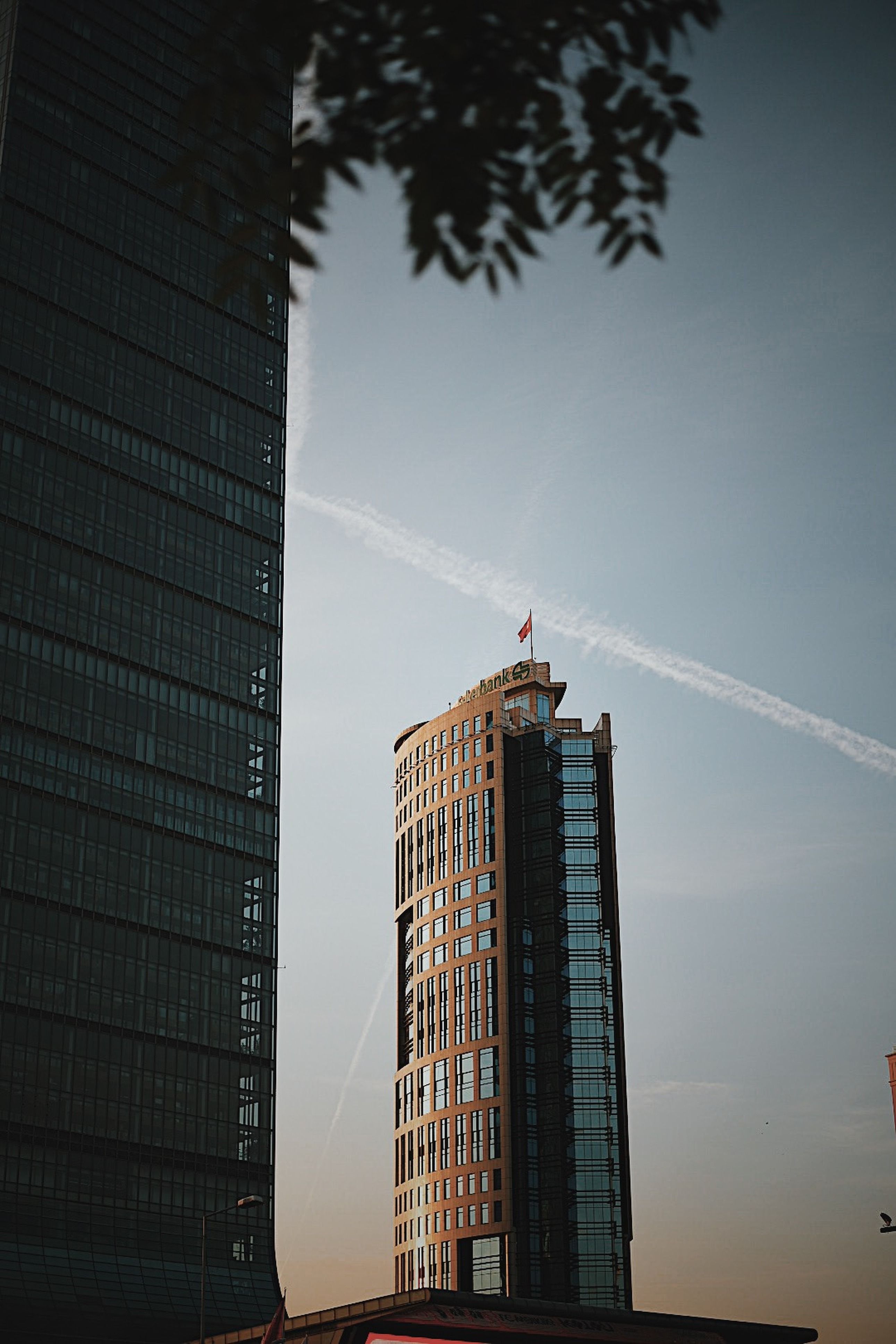 A Concrete Building with a Spire on Tower · Free Stock Photo