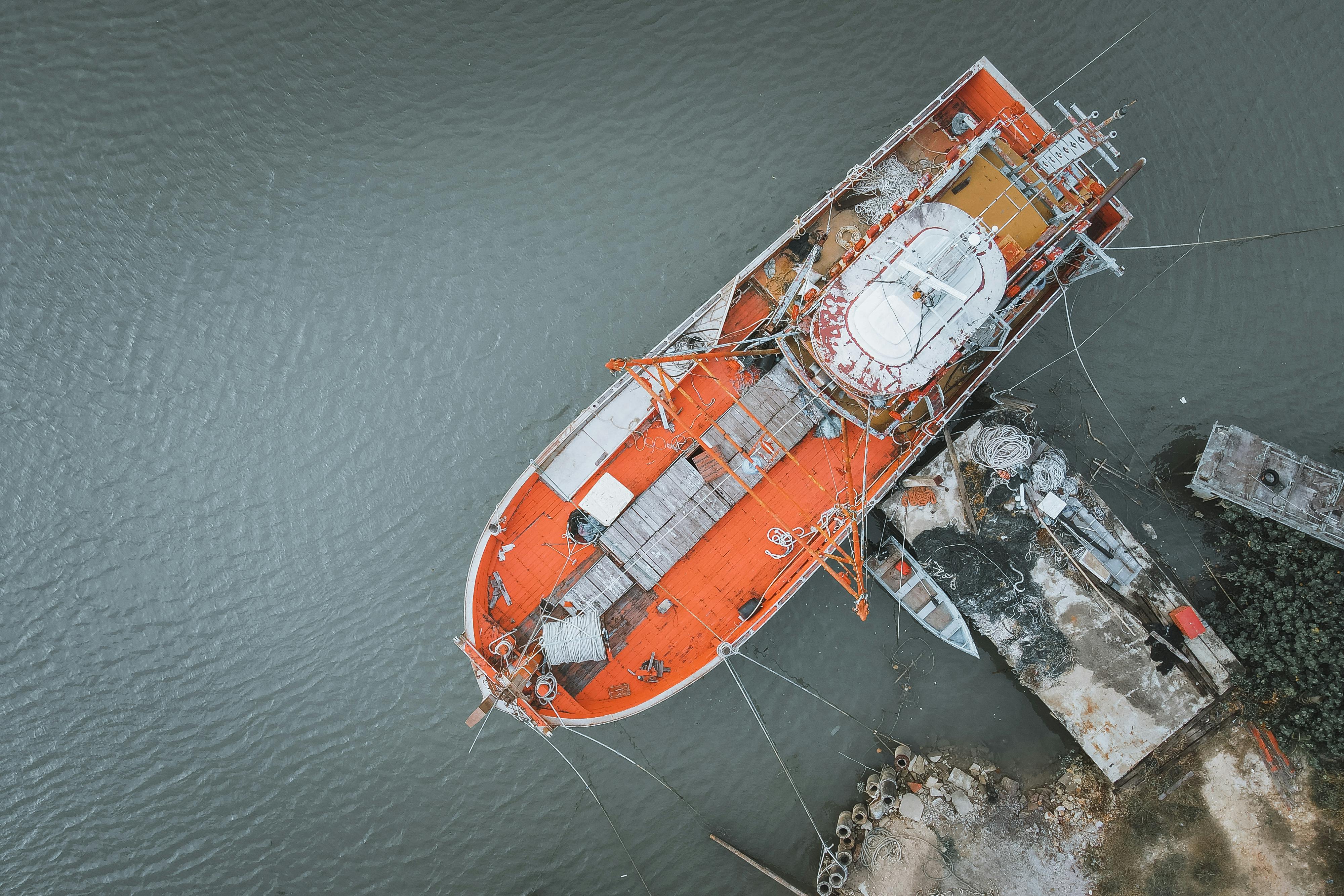 Aerial View of Boat Docked in Harbor · Free Stock Photo