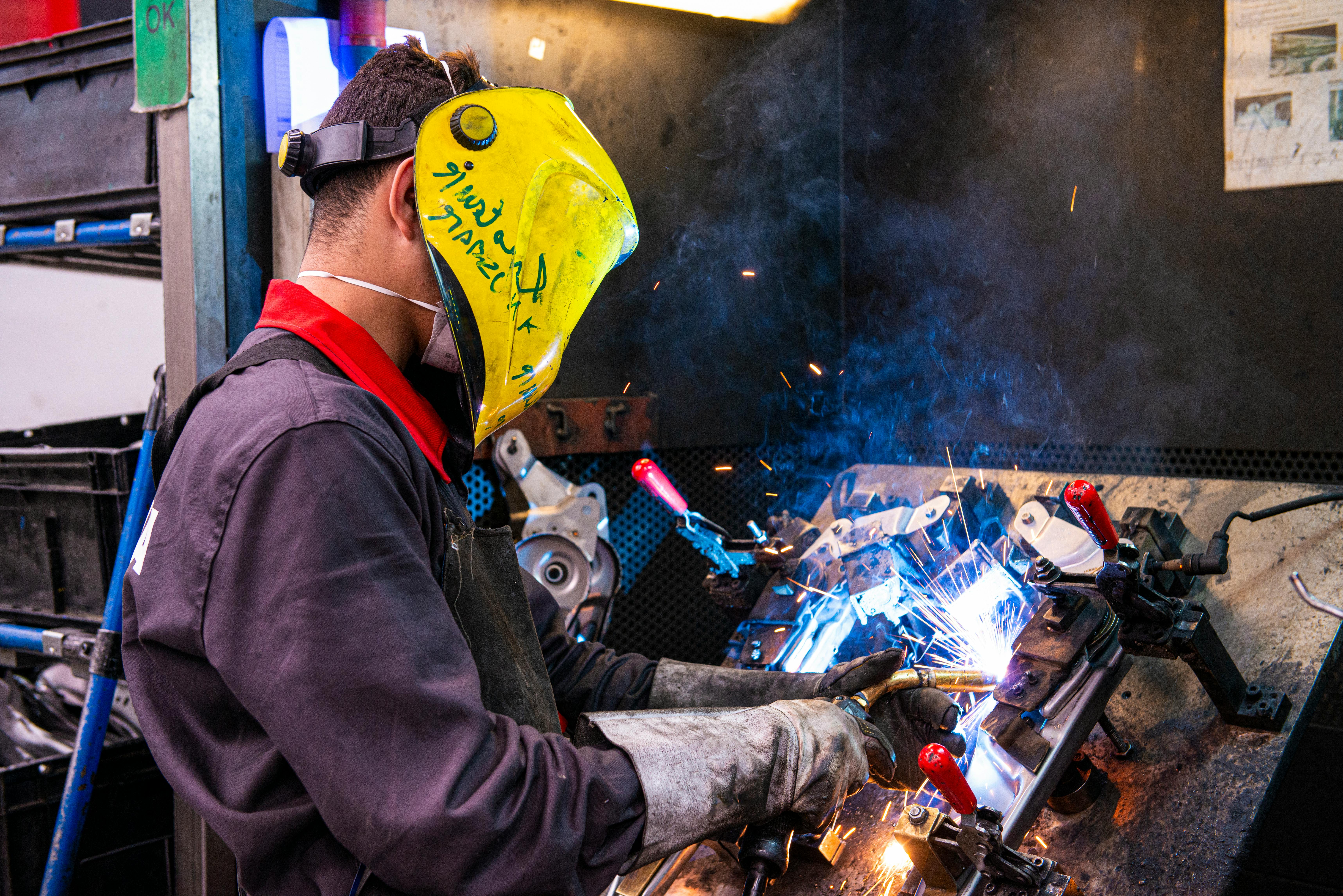 Person Welding Metal · Free Stock Photo