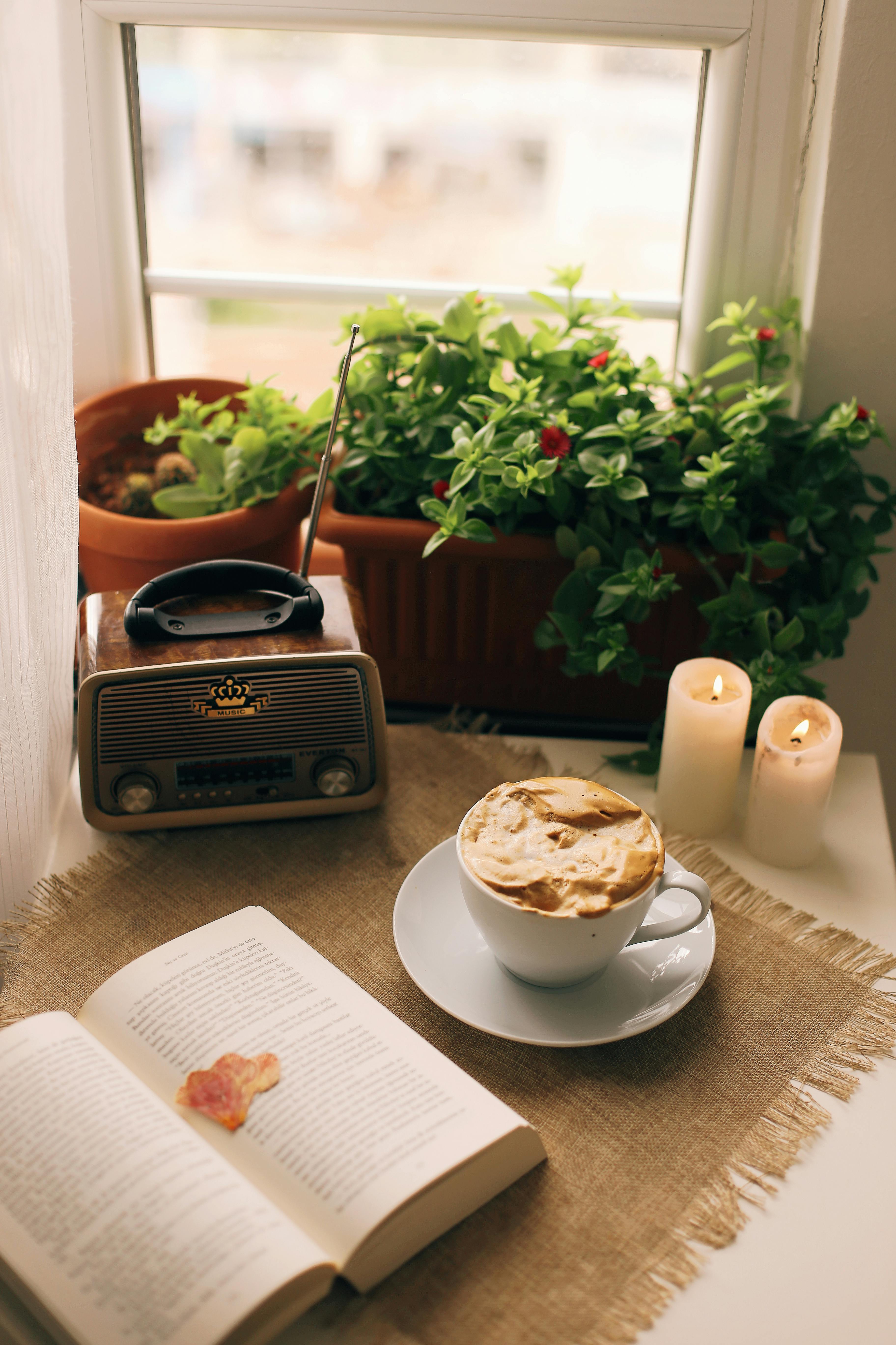 An Open Book beside a Cup of Coffee · Free Stock Photo