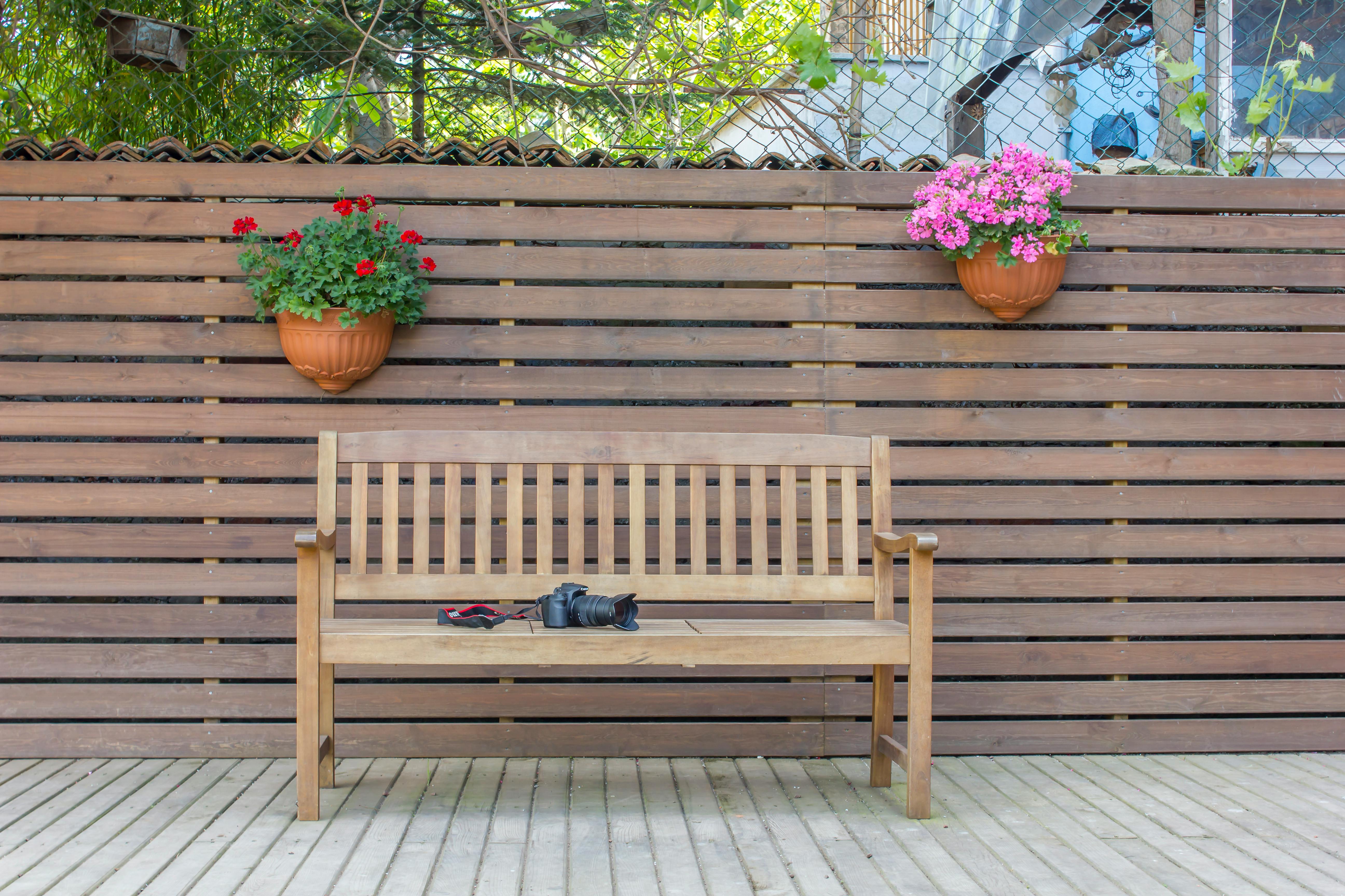 Wooden Bench Beside Brown Wood Fence · Free Stock Photo