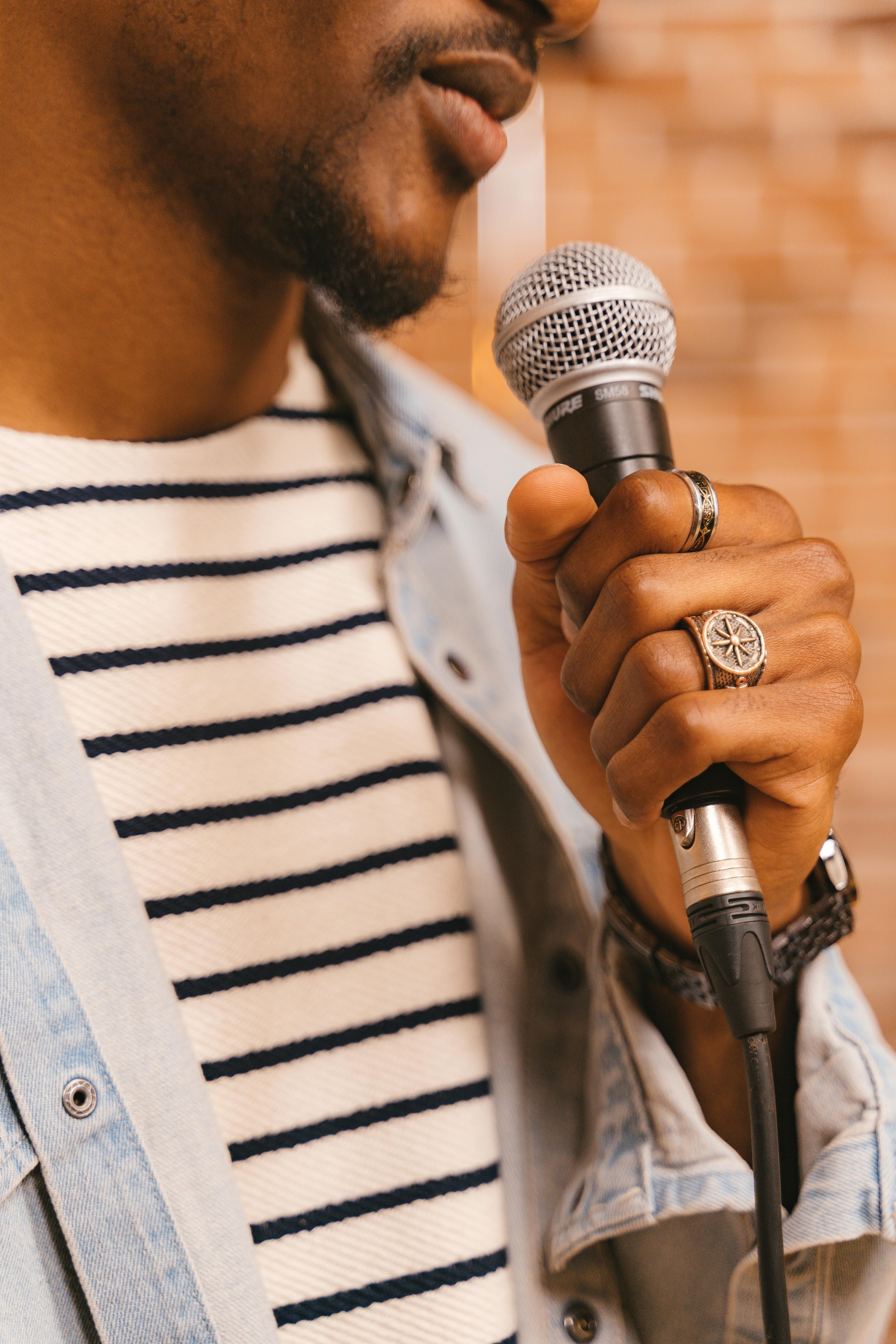 A Man Using Microphone · Free Stock Photo