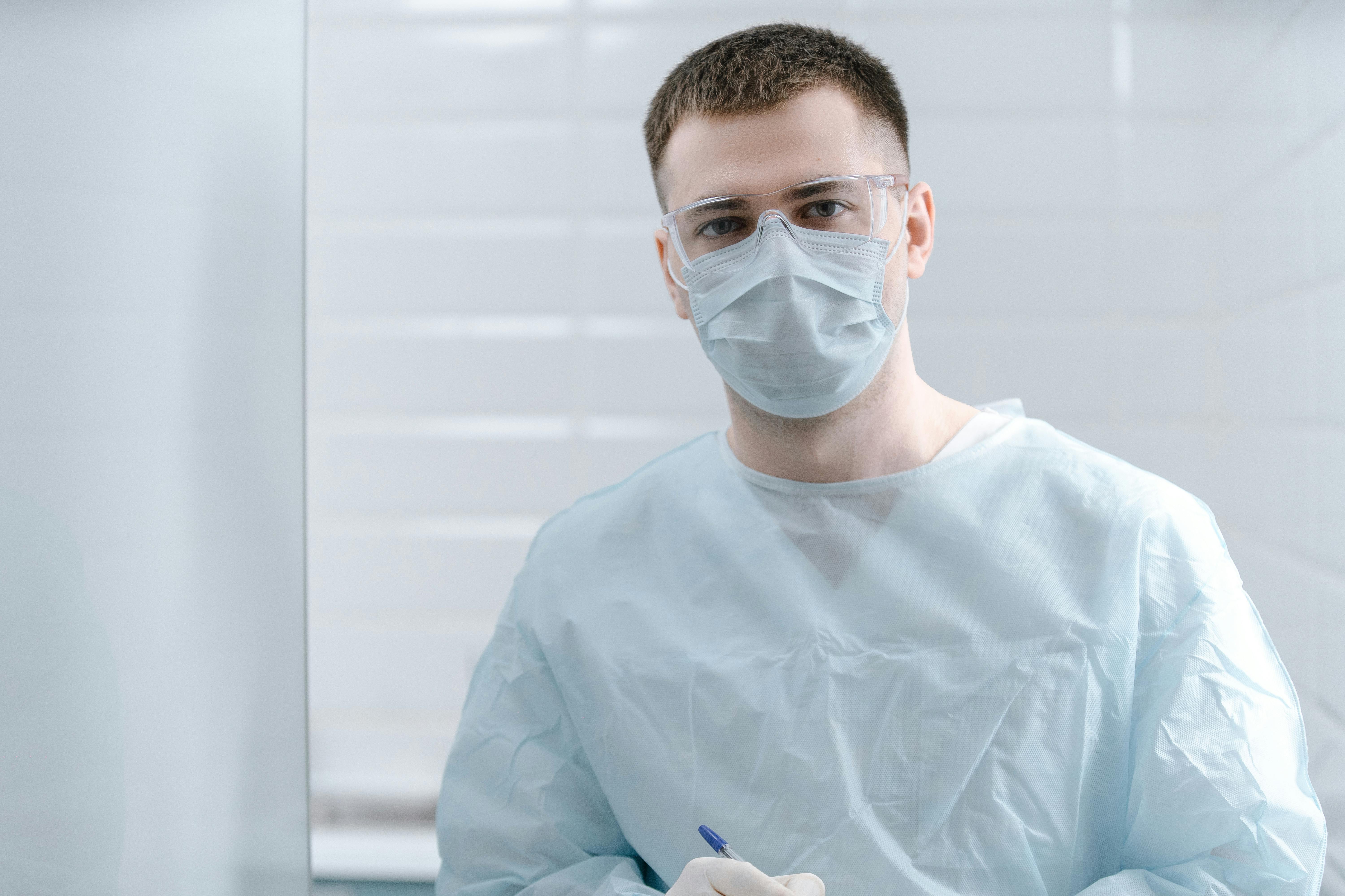 Doctor wearing Face Mask and a Scrub Suit · Free Stock Photo