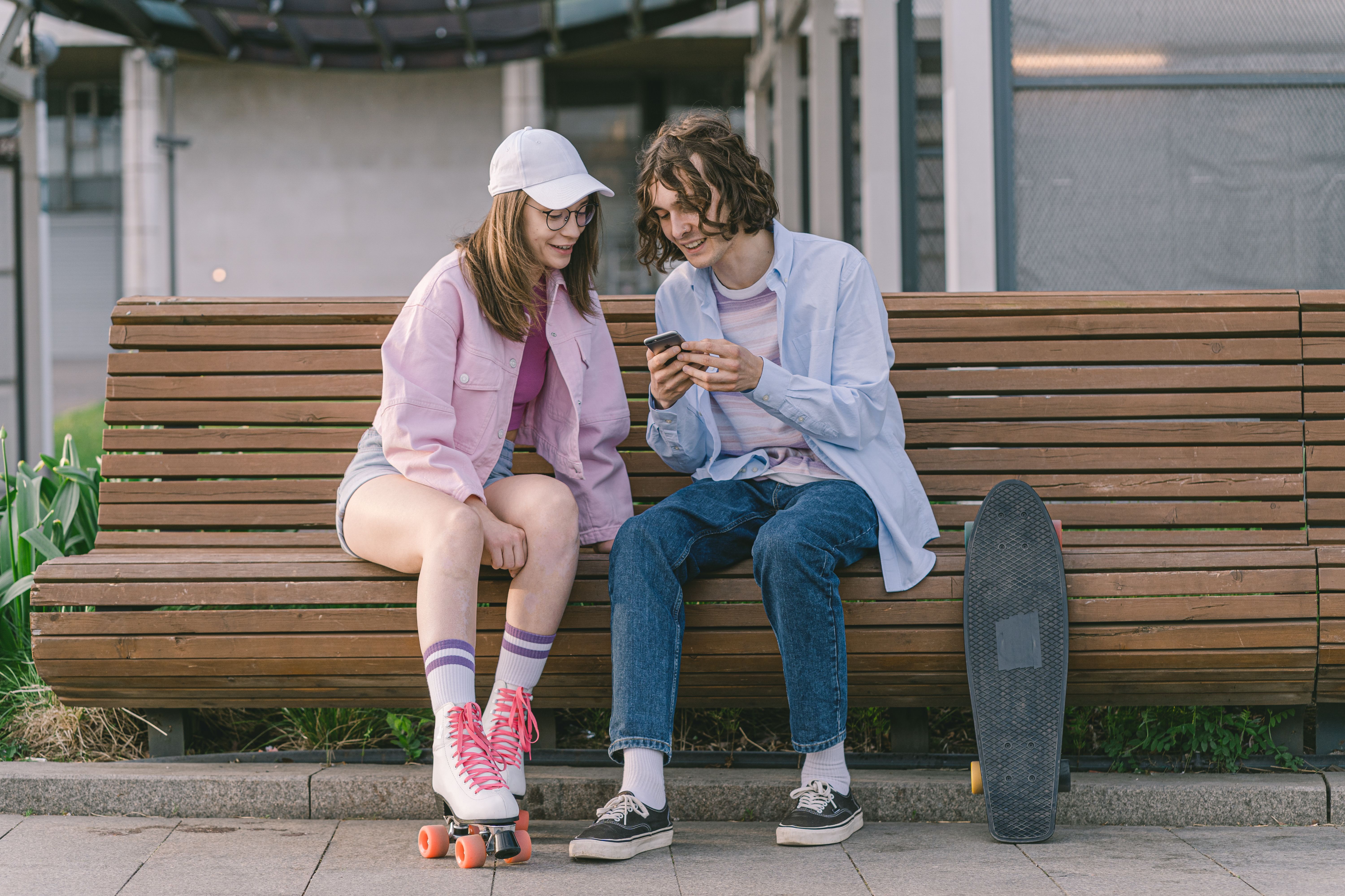 Two People sitting on Wooden Bench · Free Stock Photo