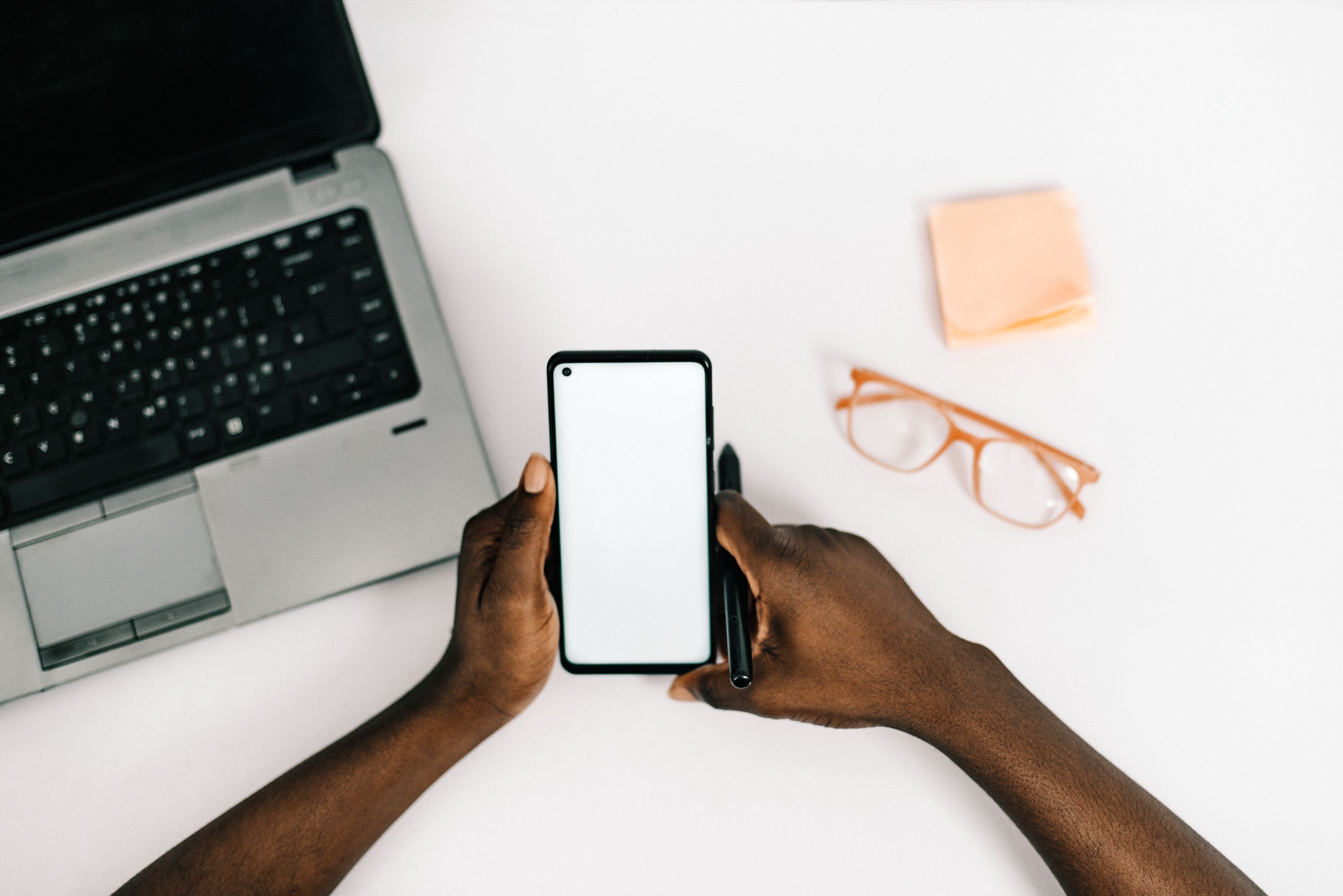 Person Holding Black Iphone · Free Stock Photo