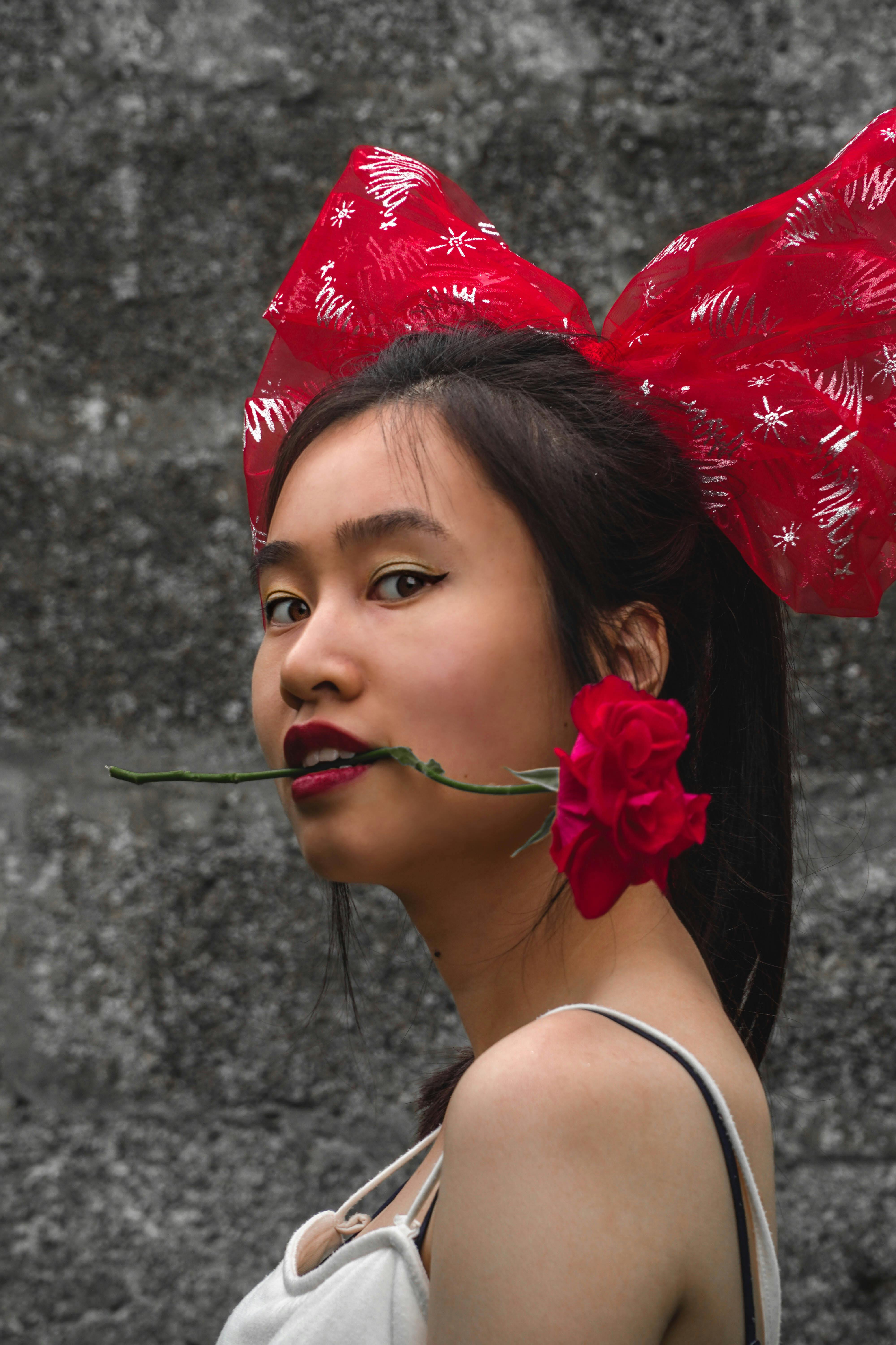 A Woman Wearing Red Ribbon Headband · Free Stock Photo