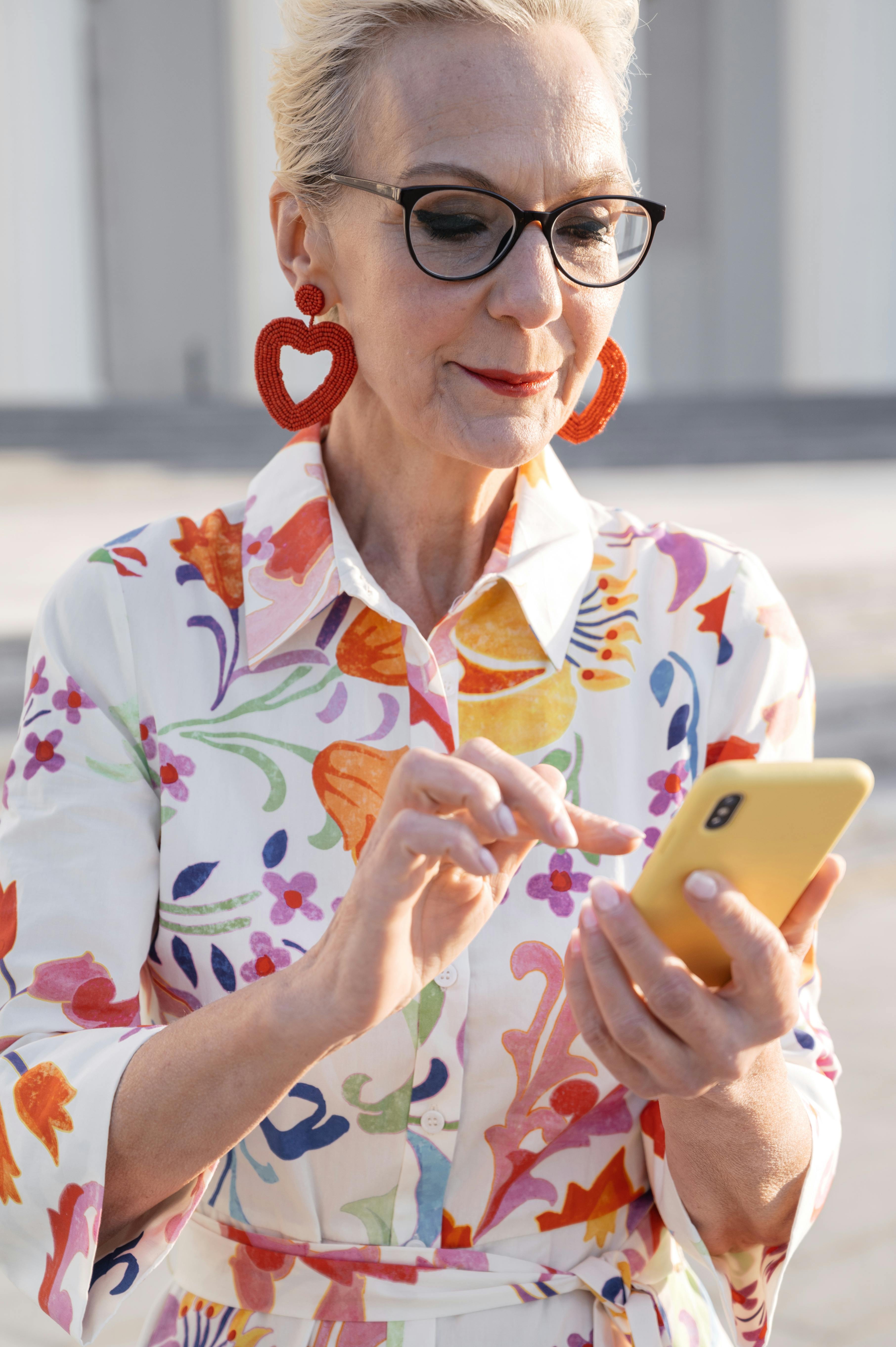 An Elderly Woman Using a Smartphone · Free Stock Photo