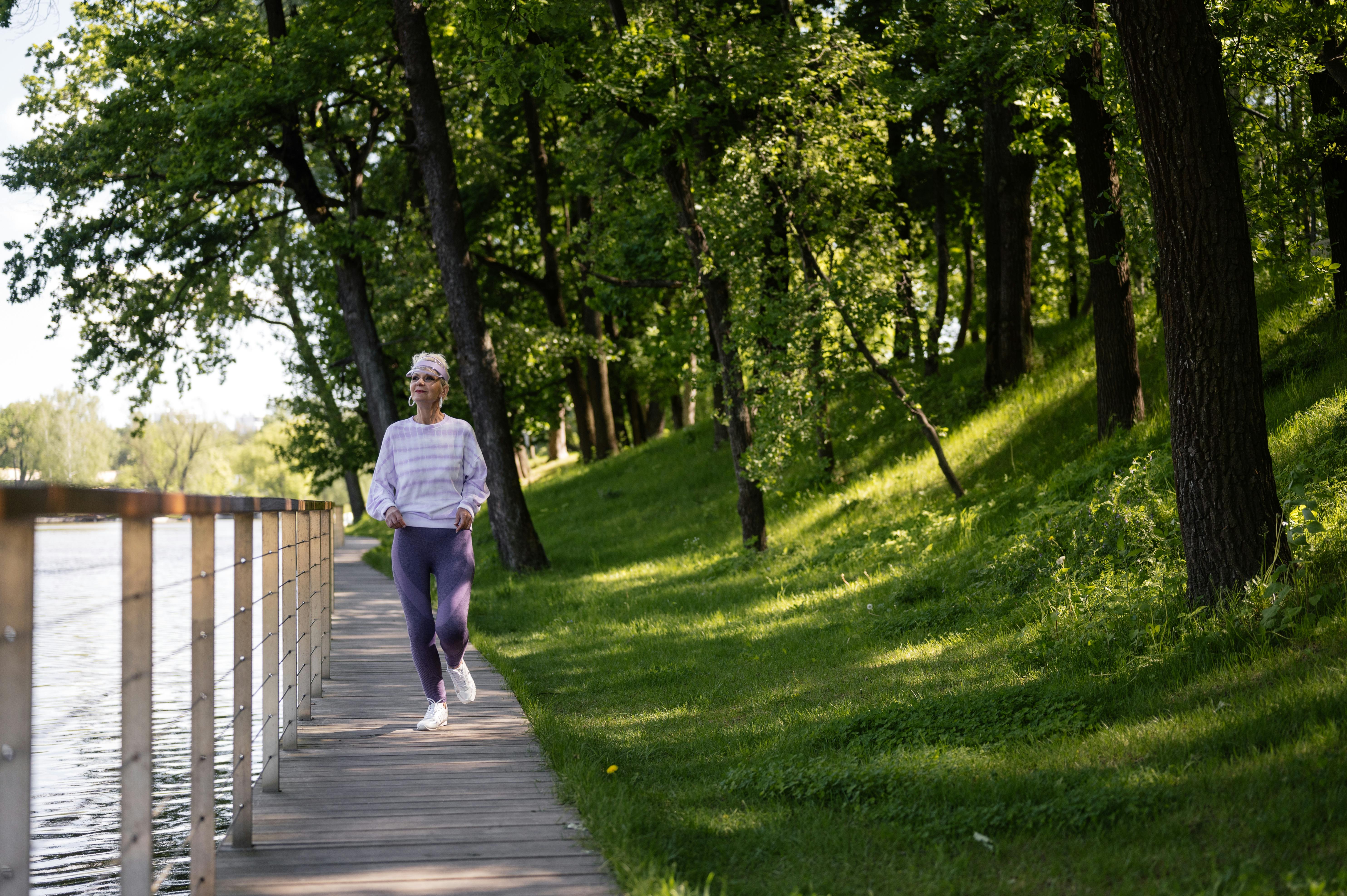 Elderly Woman Jogging in Park · Free Stock Photo