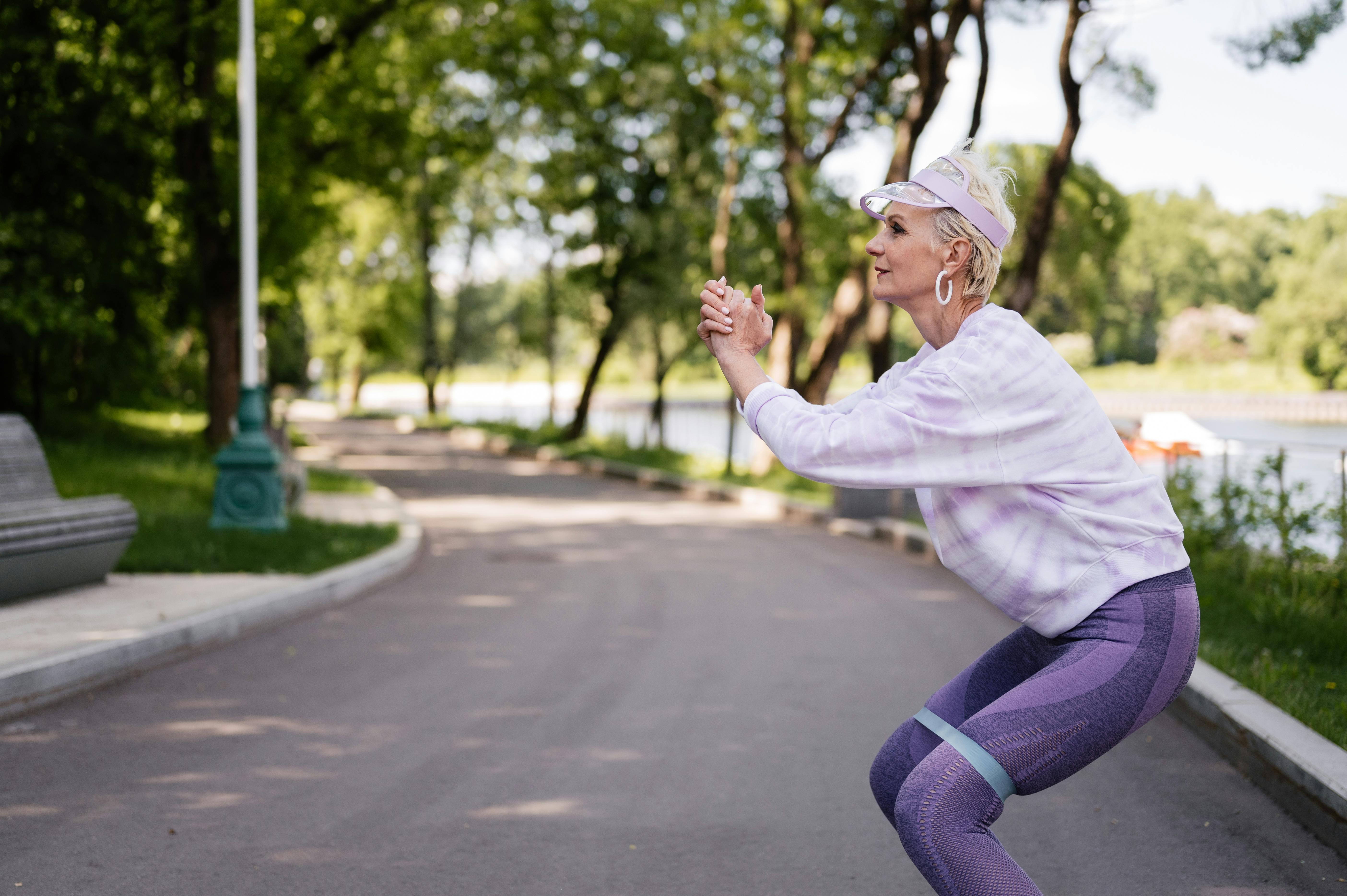 Woman in Purple Sweater and Purple Leggings doing Exercise · Free Stock ...
