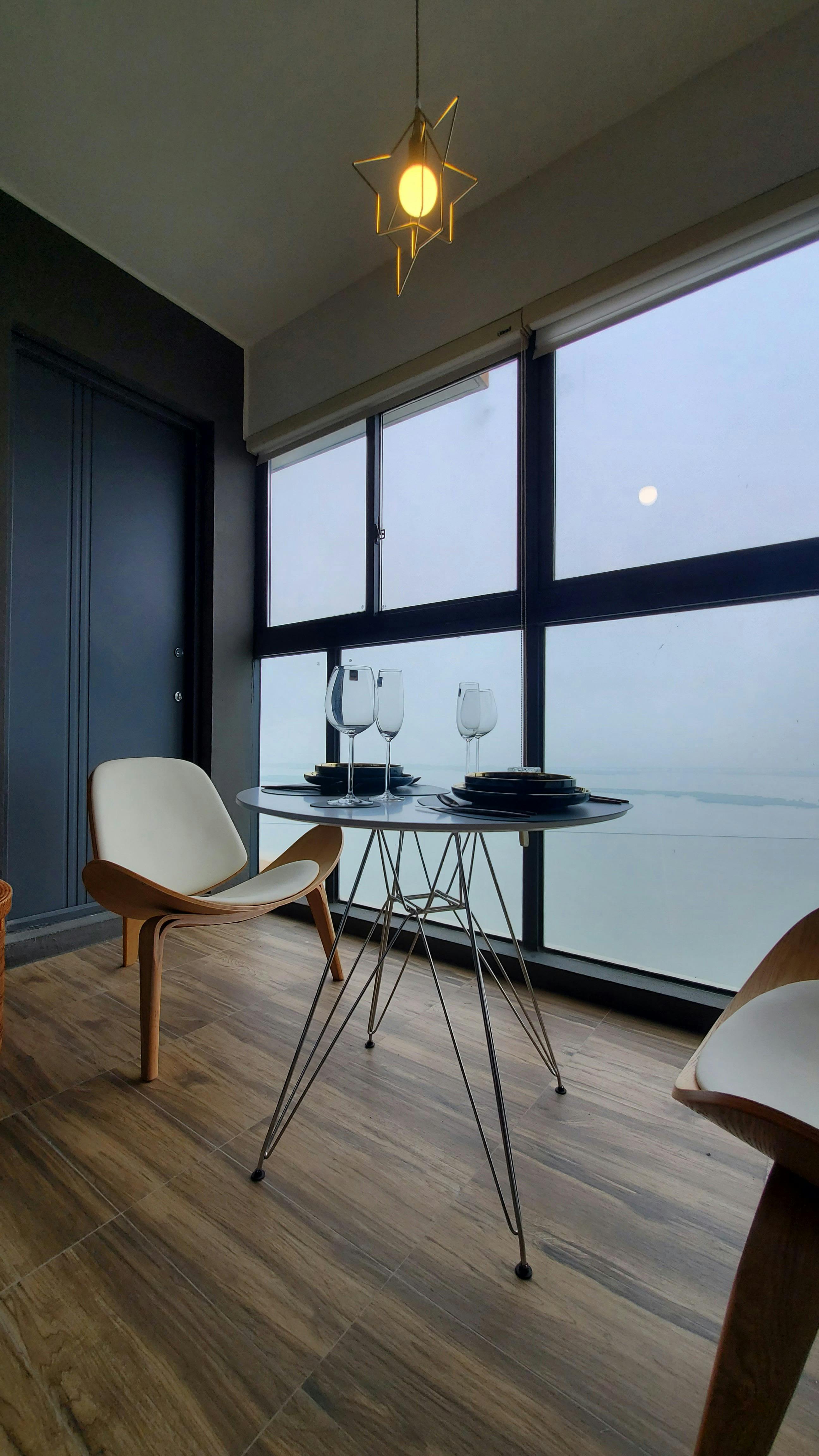 Round Table and Chair Beside Big Window · Free Stock Photo