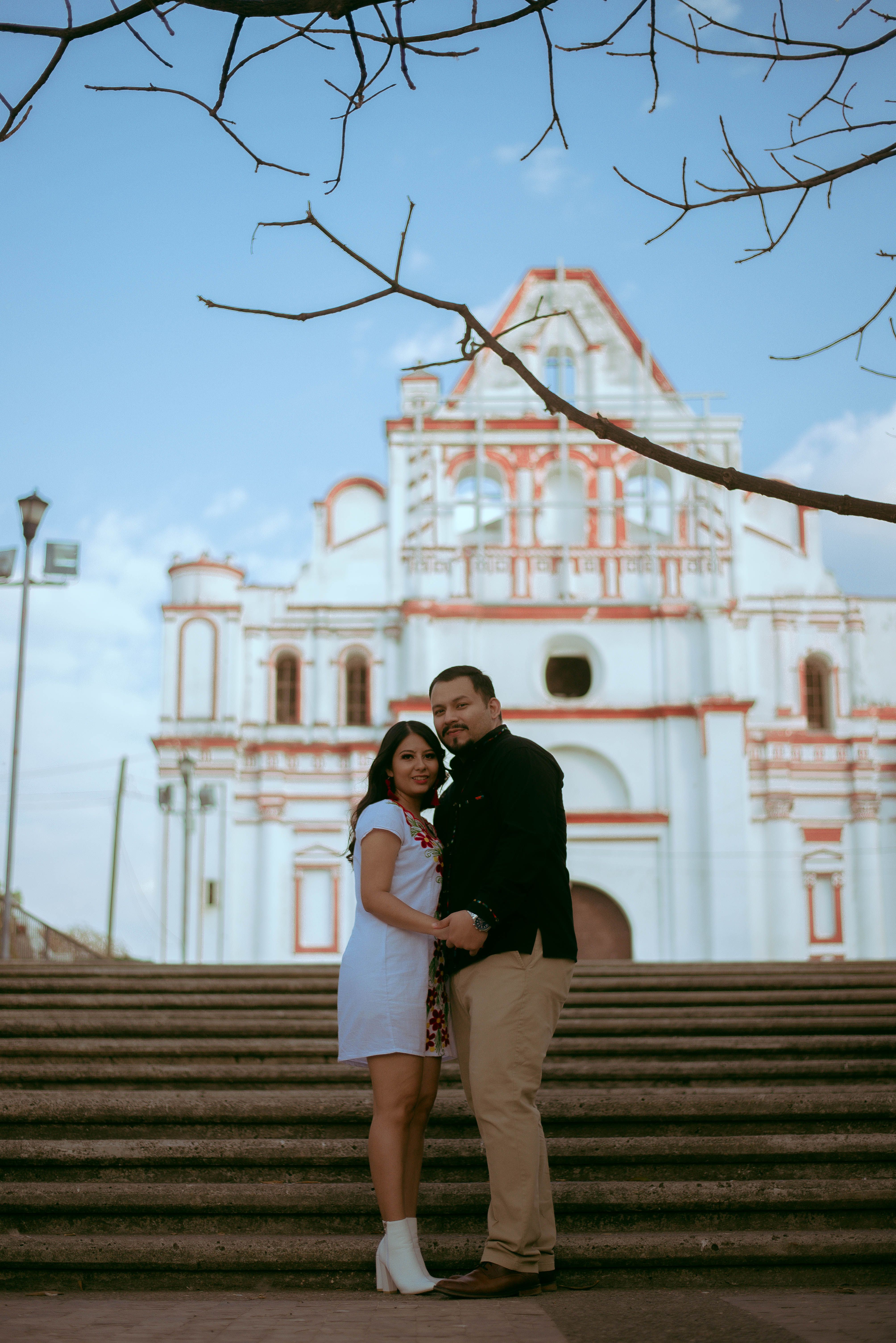 Couple Standing Together Near a Church Building · Free Stock Photo