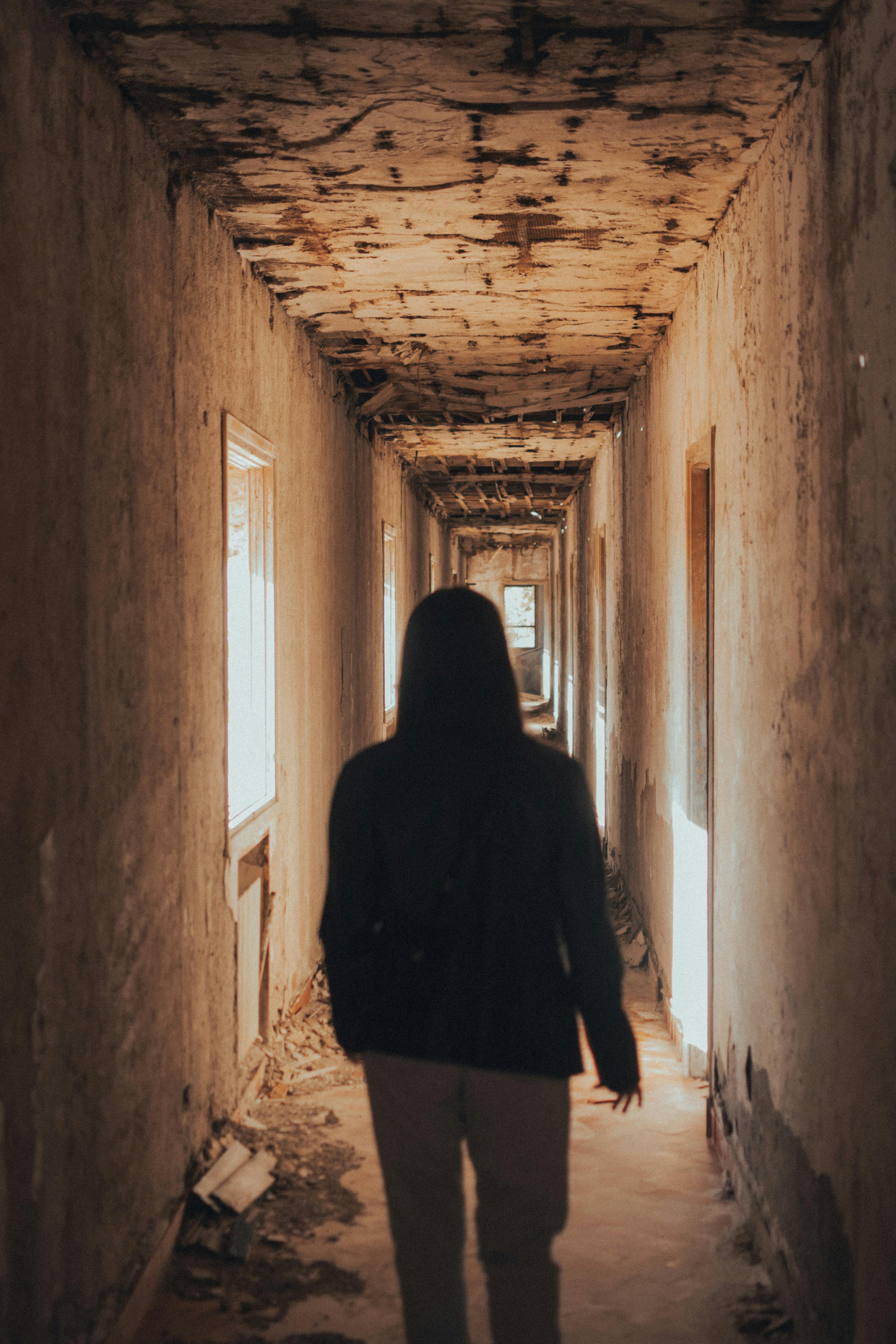 Back View of a Woman in a Corridor · Free Stock Photo