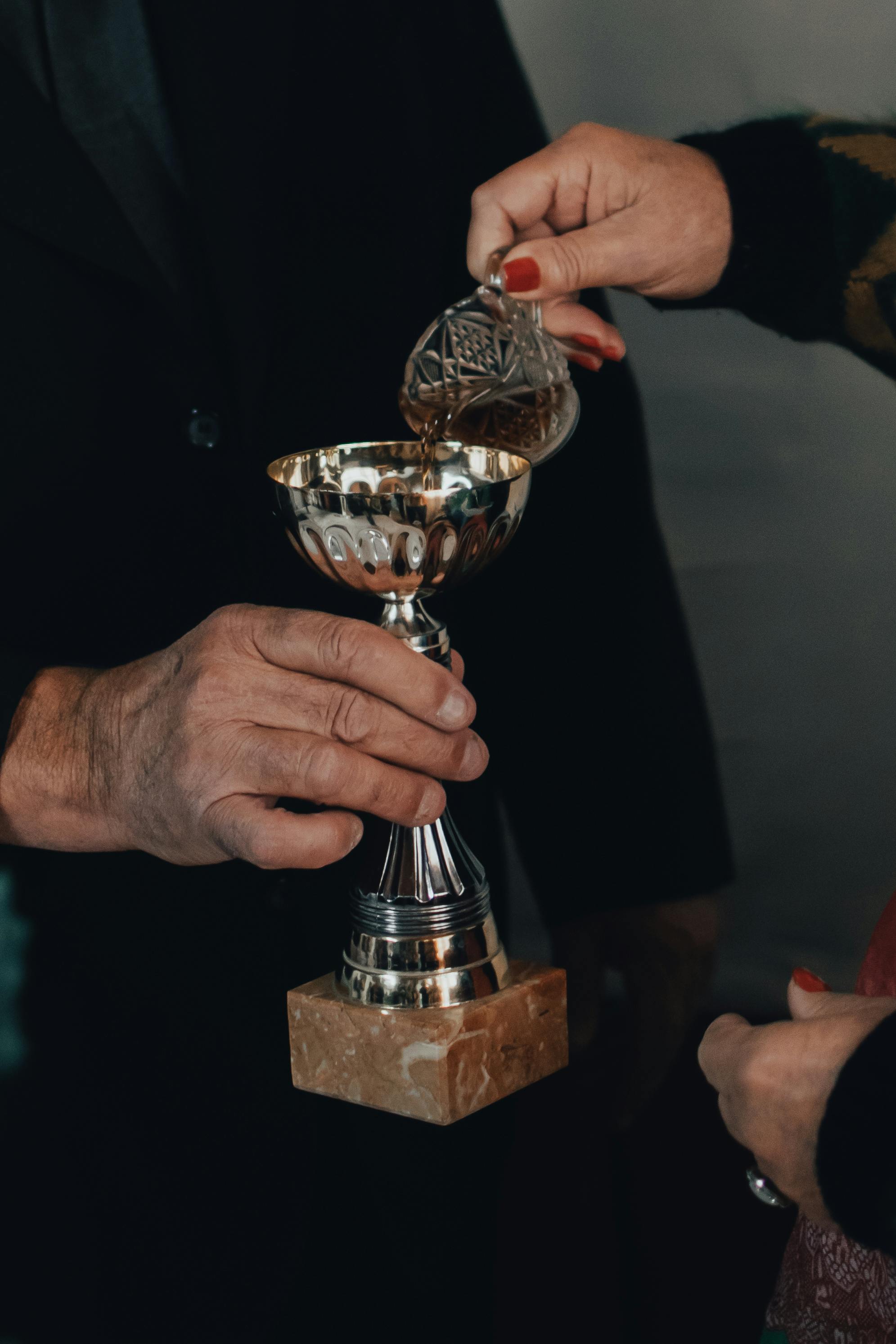 Priest Holding a Chalice · Free Stock Photo