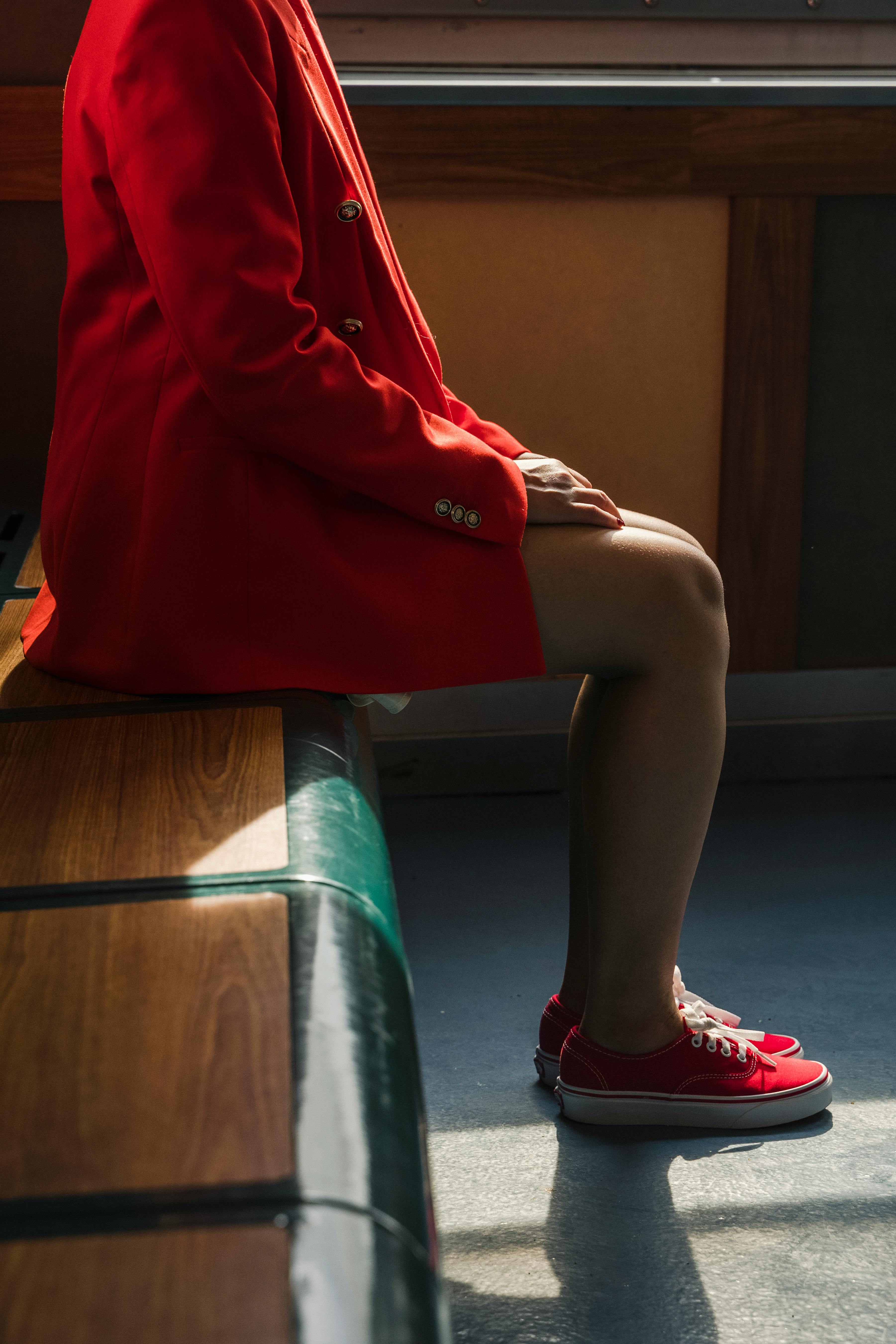 Person in Red Suit Sitting on Bench · Free Stock Photo