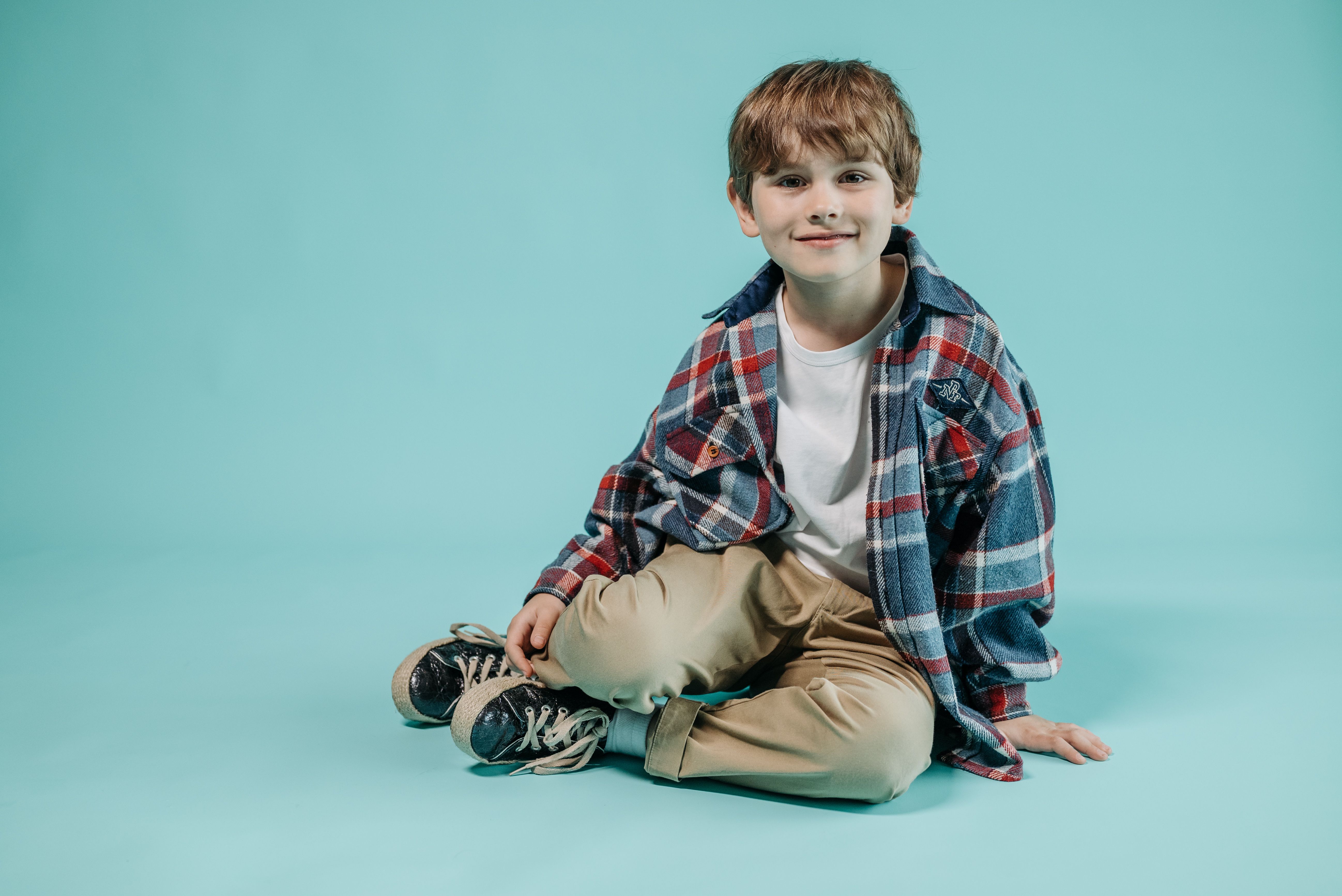 A Boy Sitting on the Floor · Free Stock Photo