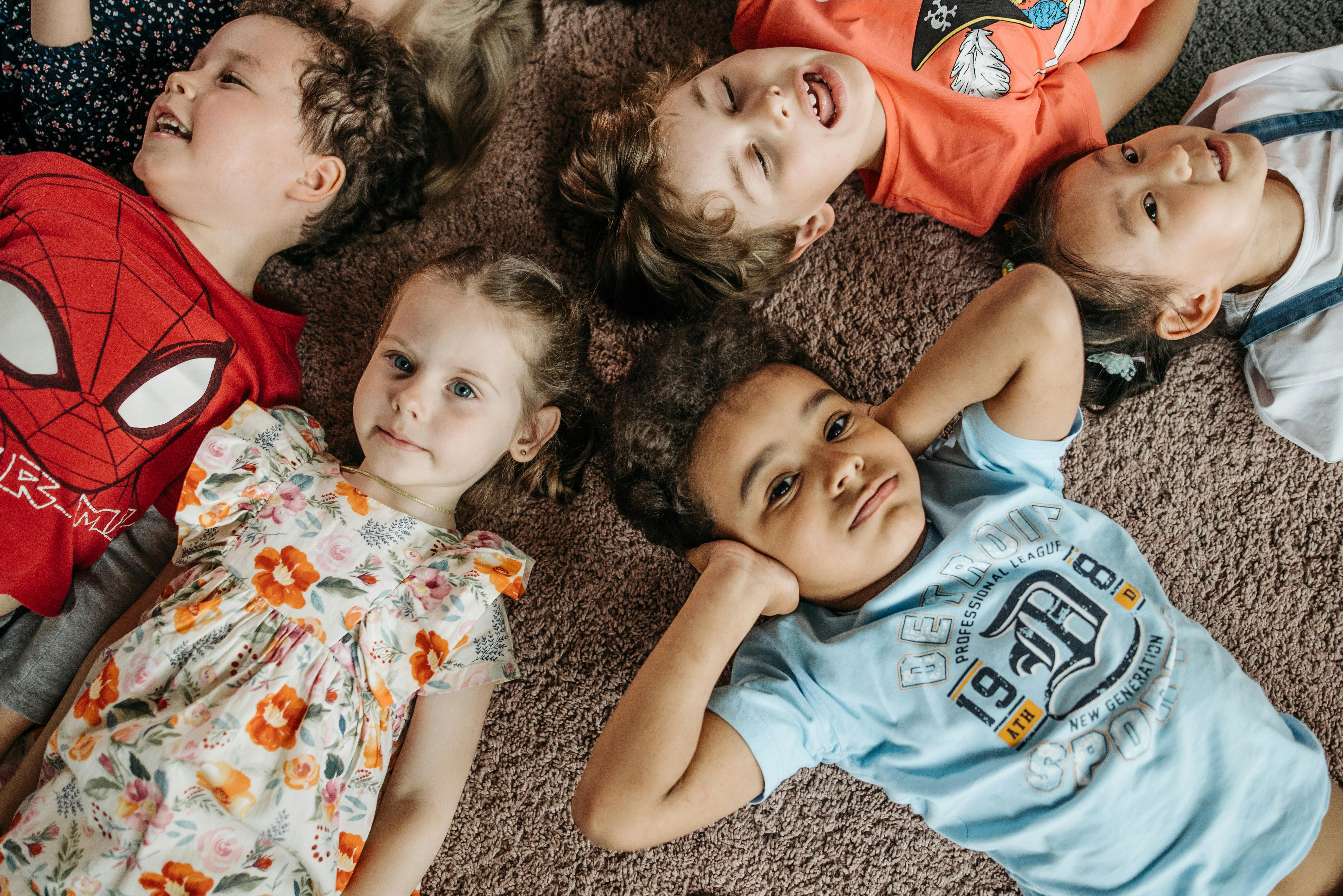 Children Lying on Carpet · Free Stock Photo
