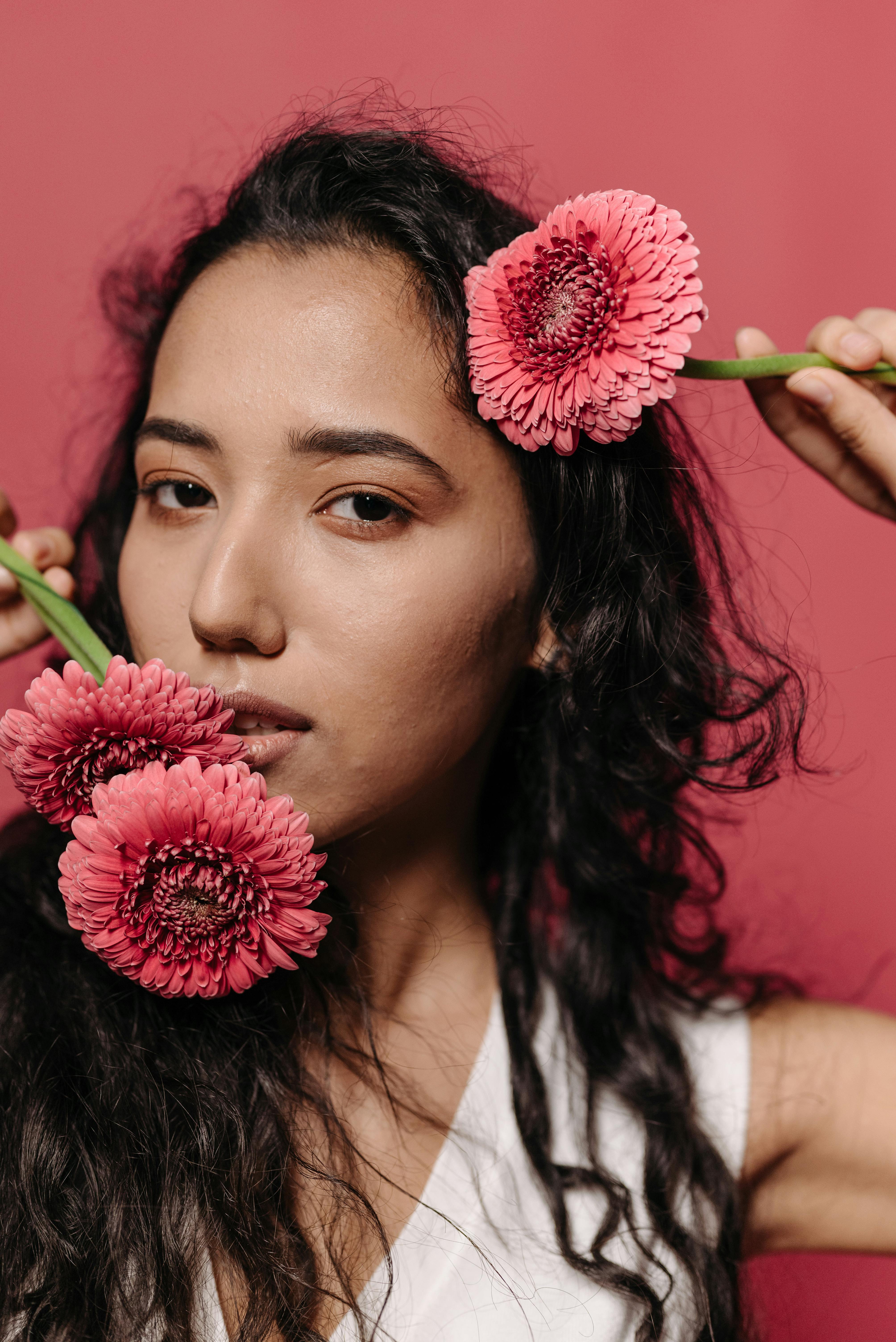 Woman Holding Pink Flowers · Free Stock Photo