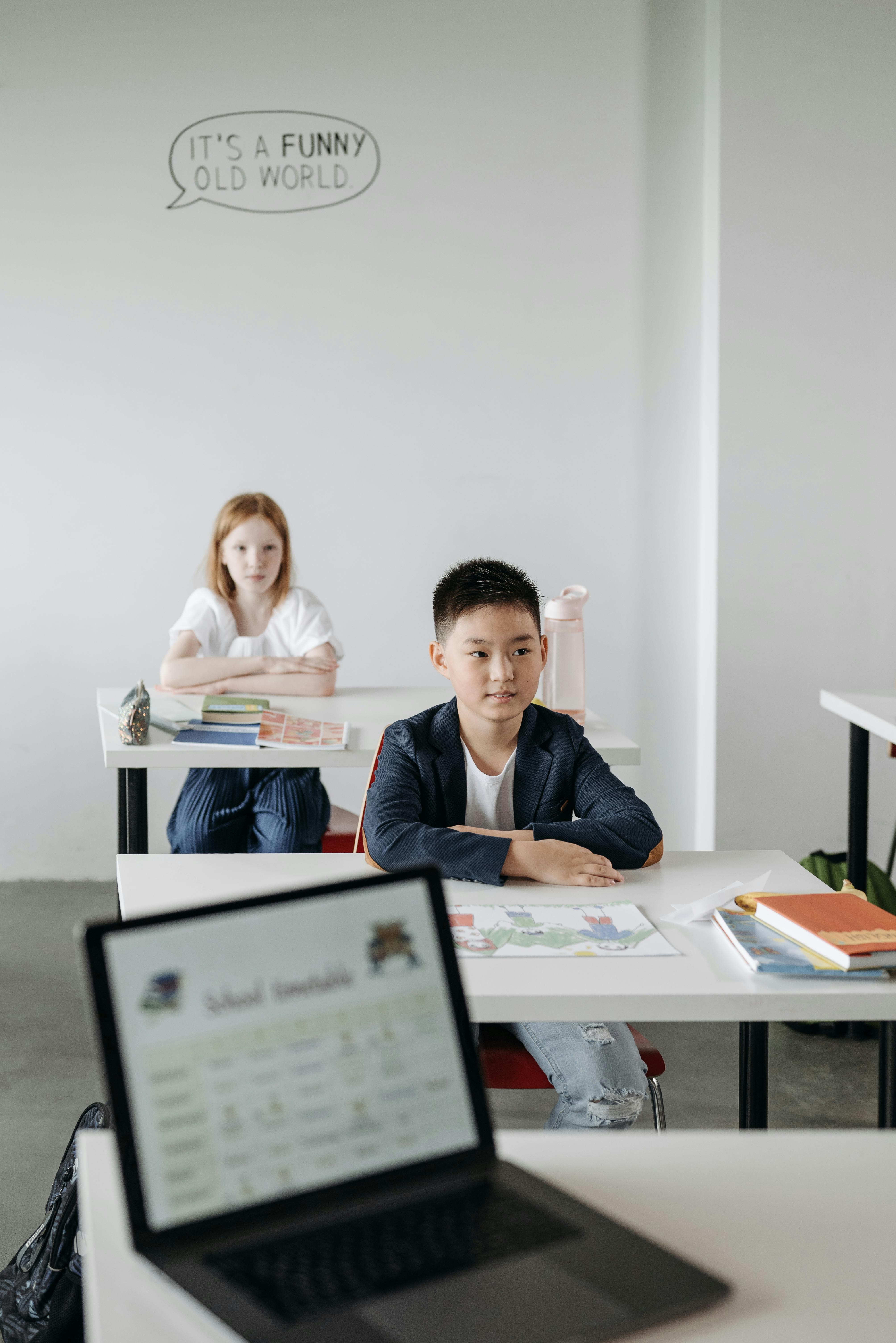 Boy Using Silver Macbook Indoors · Free Stock Photo