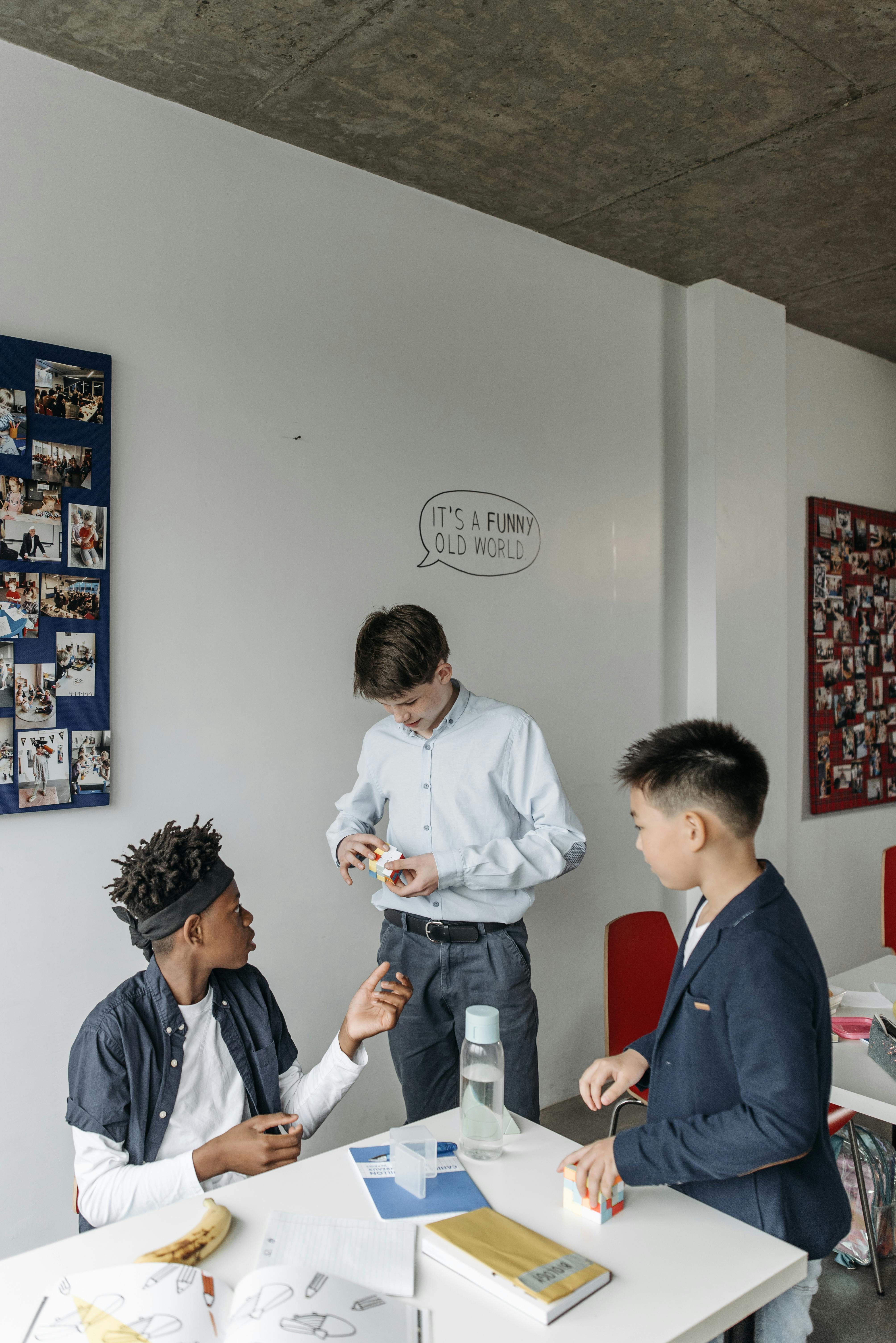 A Students Talking Together in Classroom · Free Stock Photo