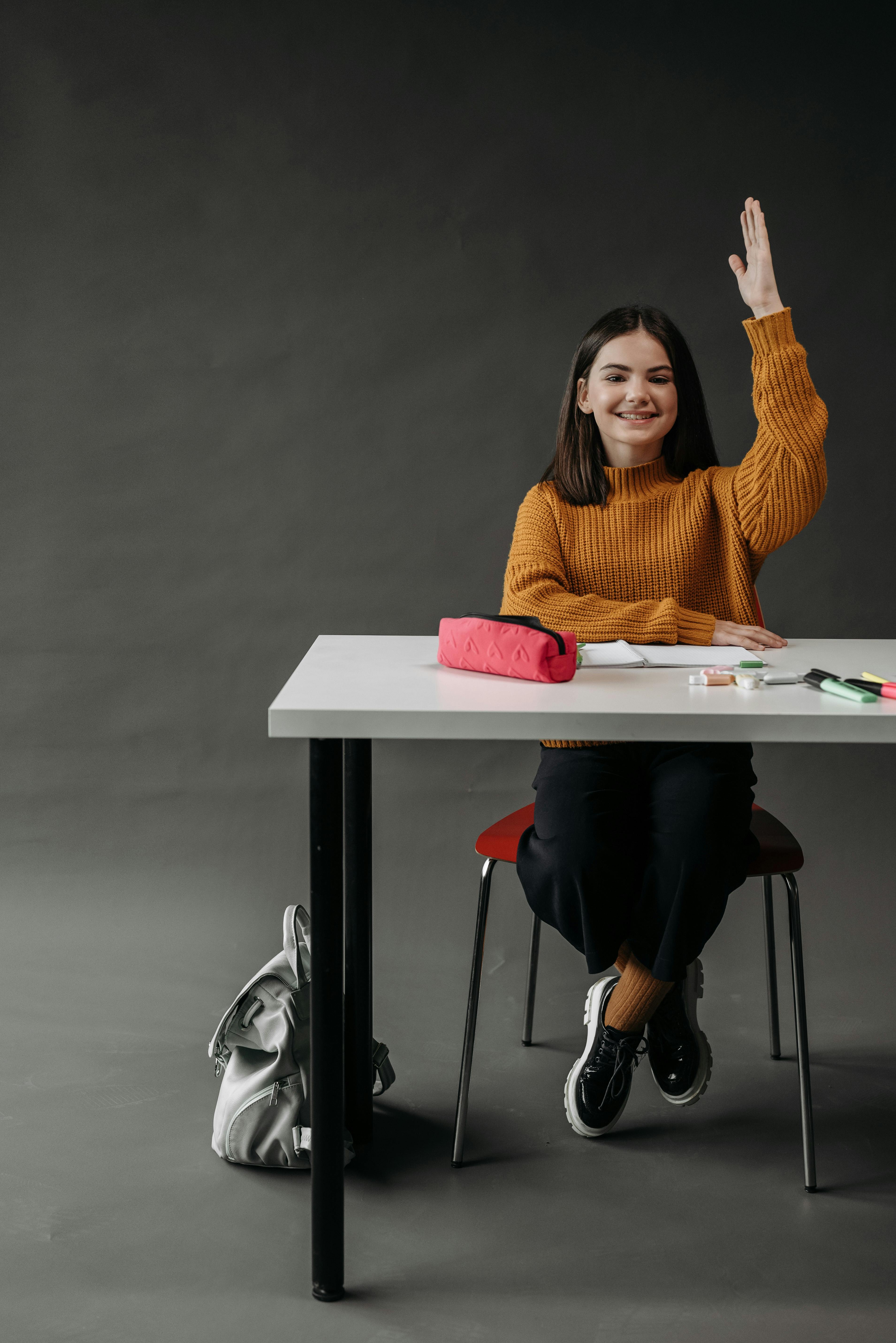 Student Raising Her Hand · Free Stock Photo