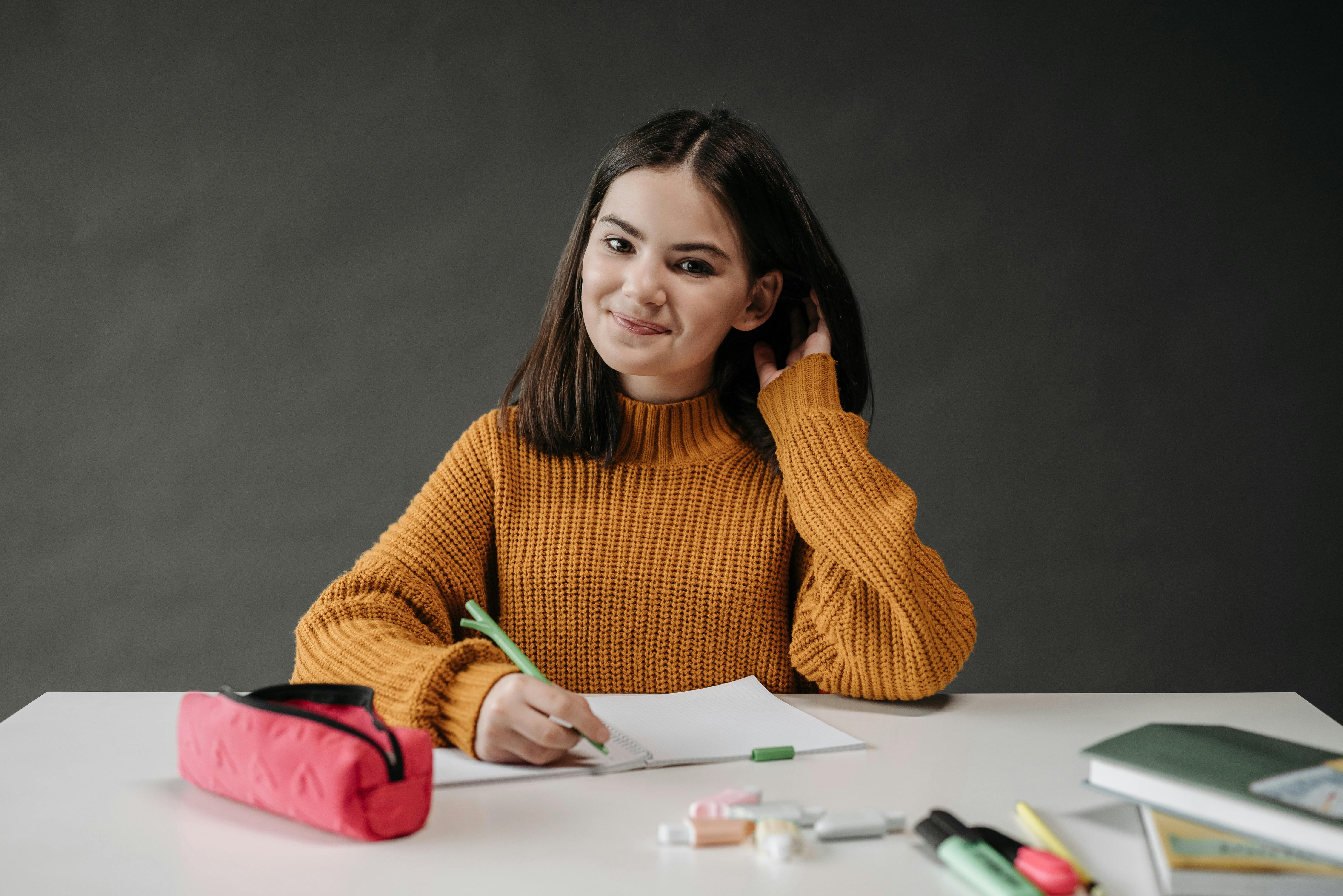 Woman in Brown Turtleneck Sweater Doing Schoolwork · Free Stock Photo