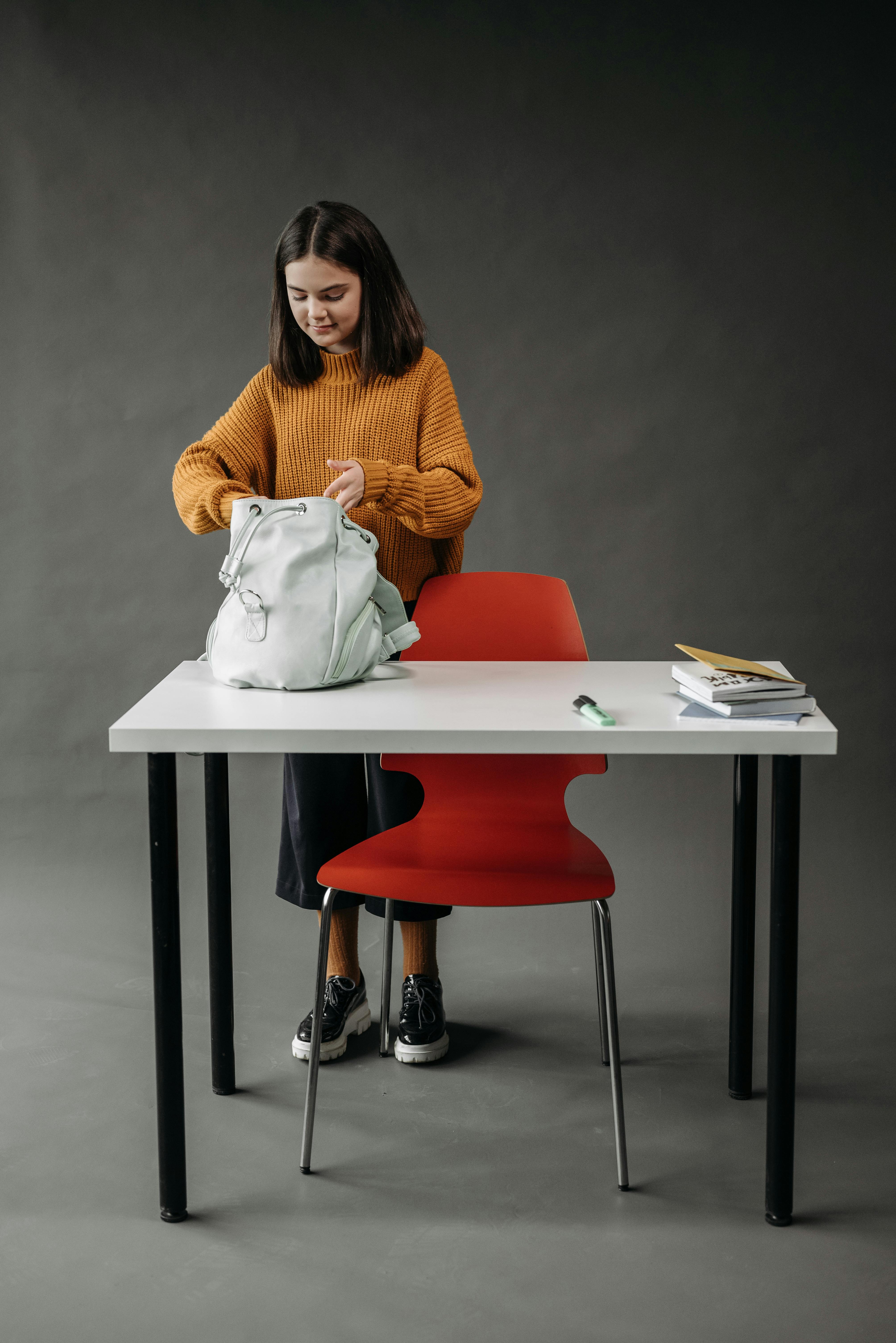A Girl Standing Near the Table · Free Stock Photo