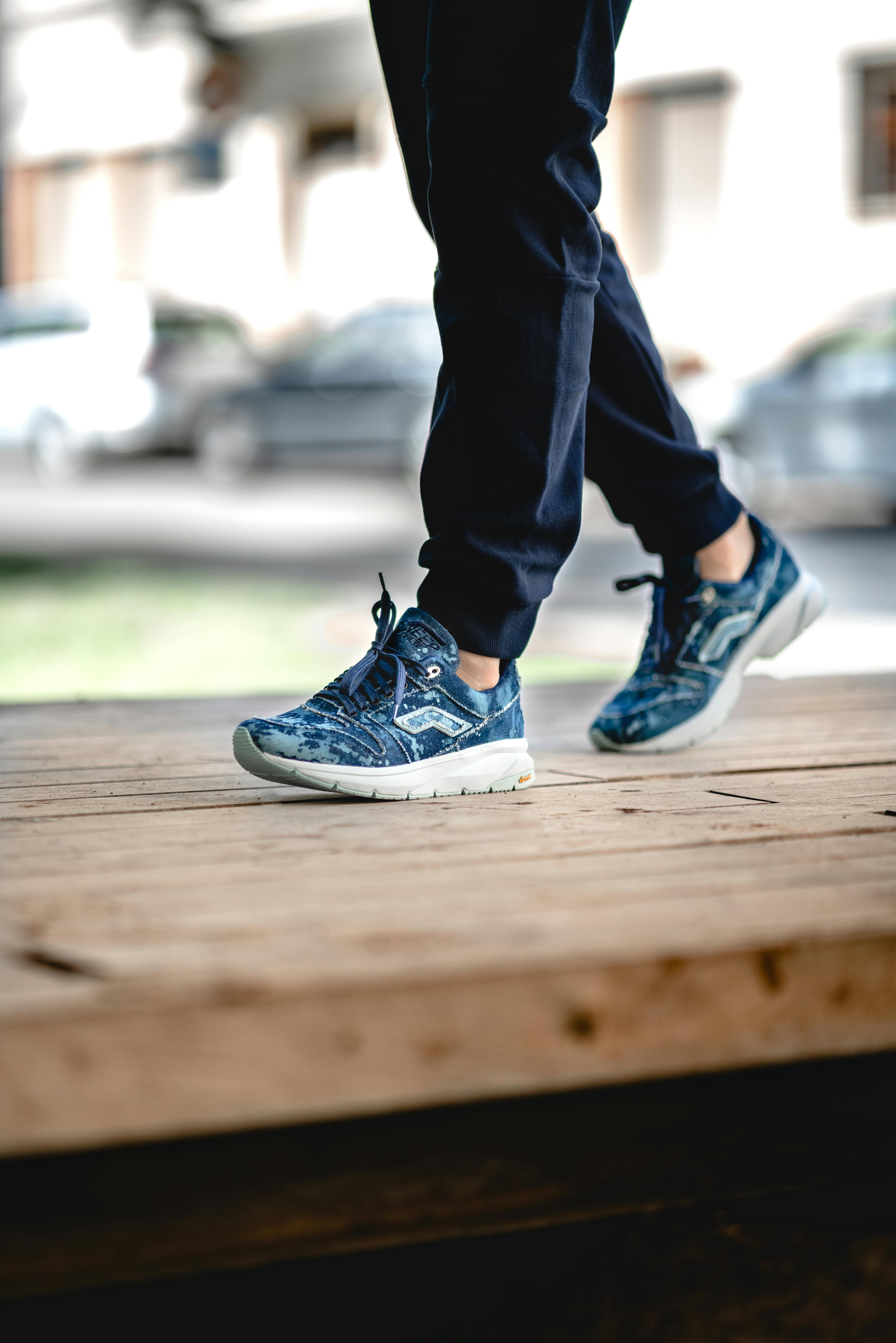 Close-Up Shot of Person Wearing a Blue Shoes · Free Stock Photo