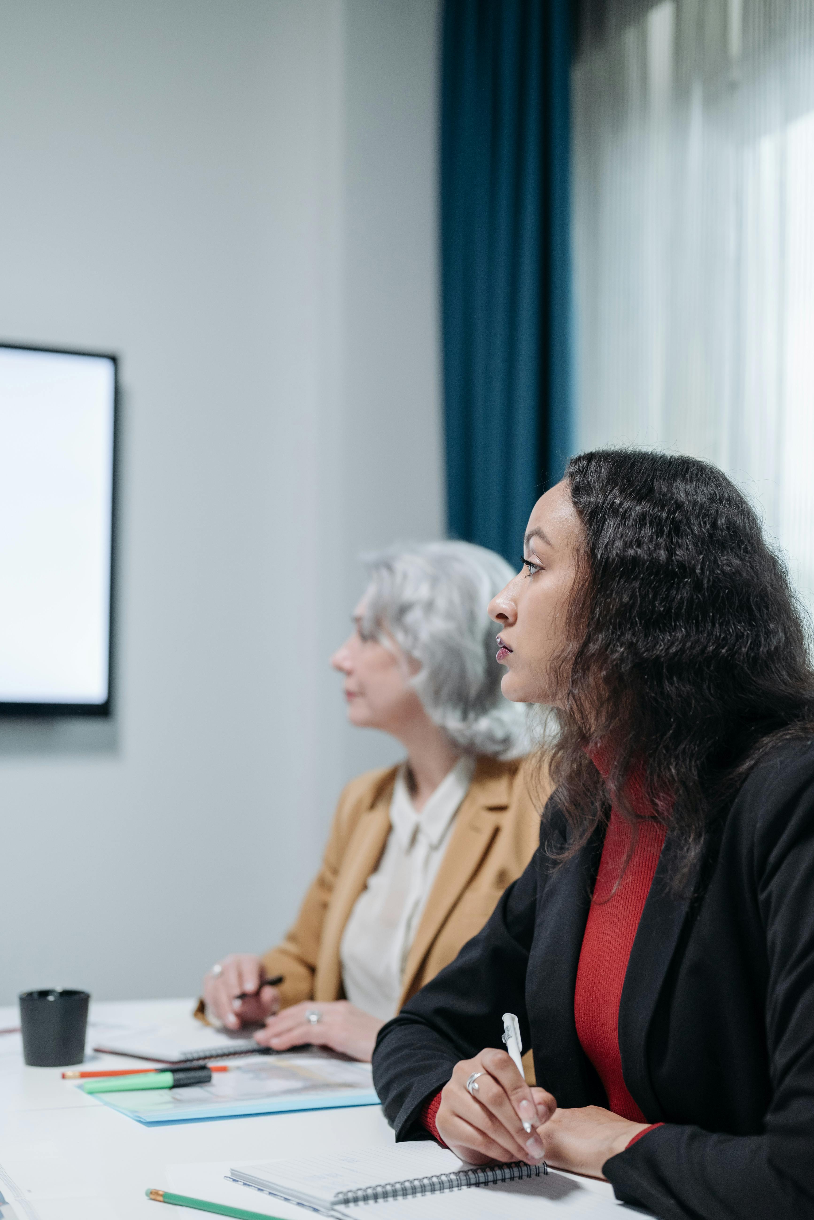 A Female Wearing Formal Clothing, Looking at Camera in an Office · Free ...