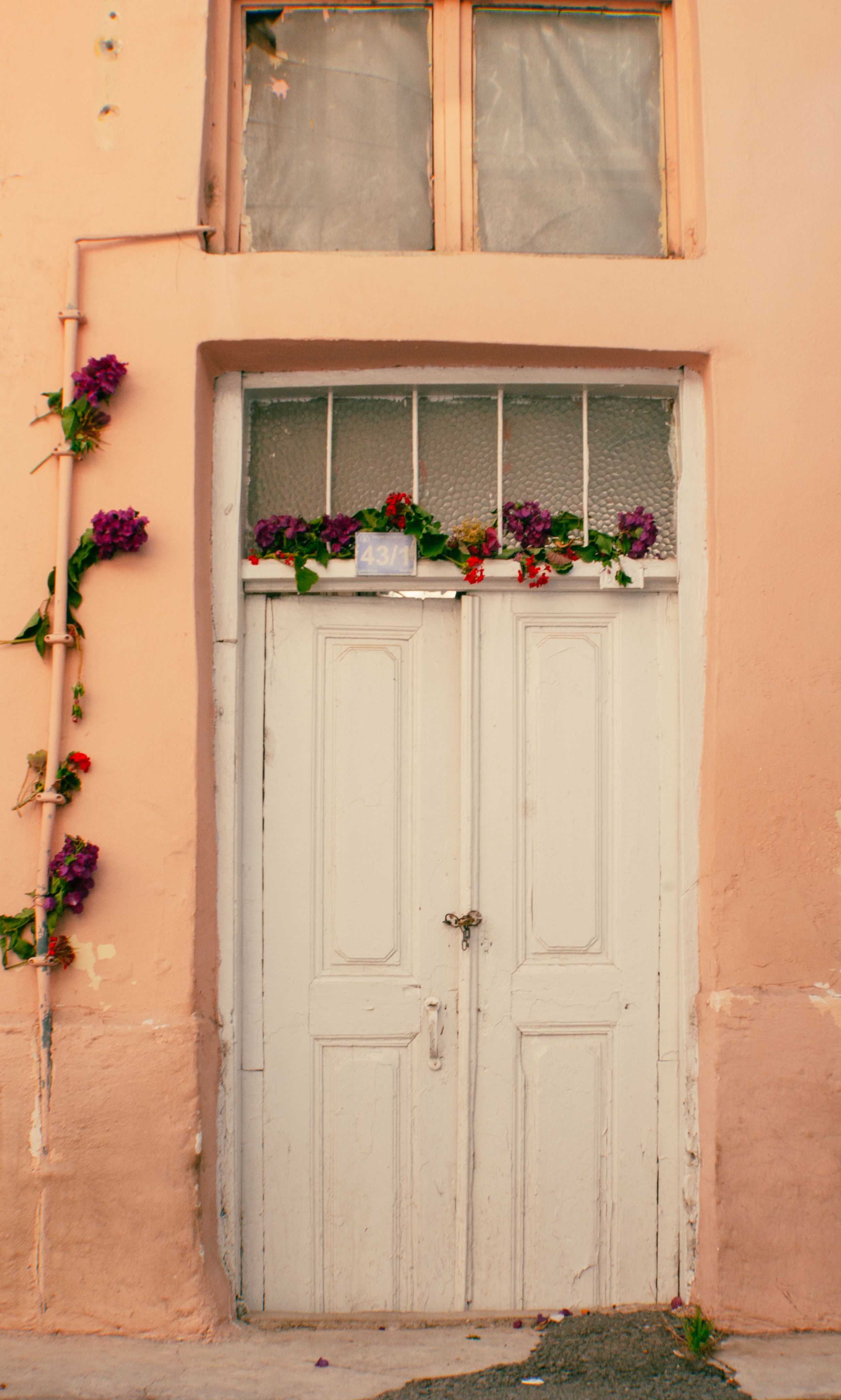 A Person Walking Towards Building Entrance · Free Stock Photo