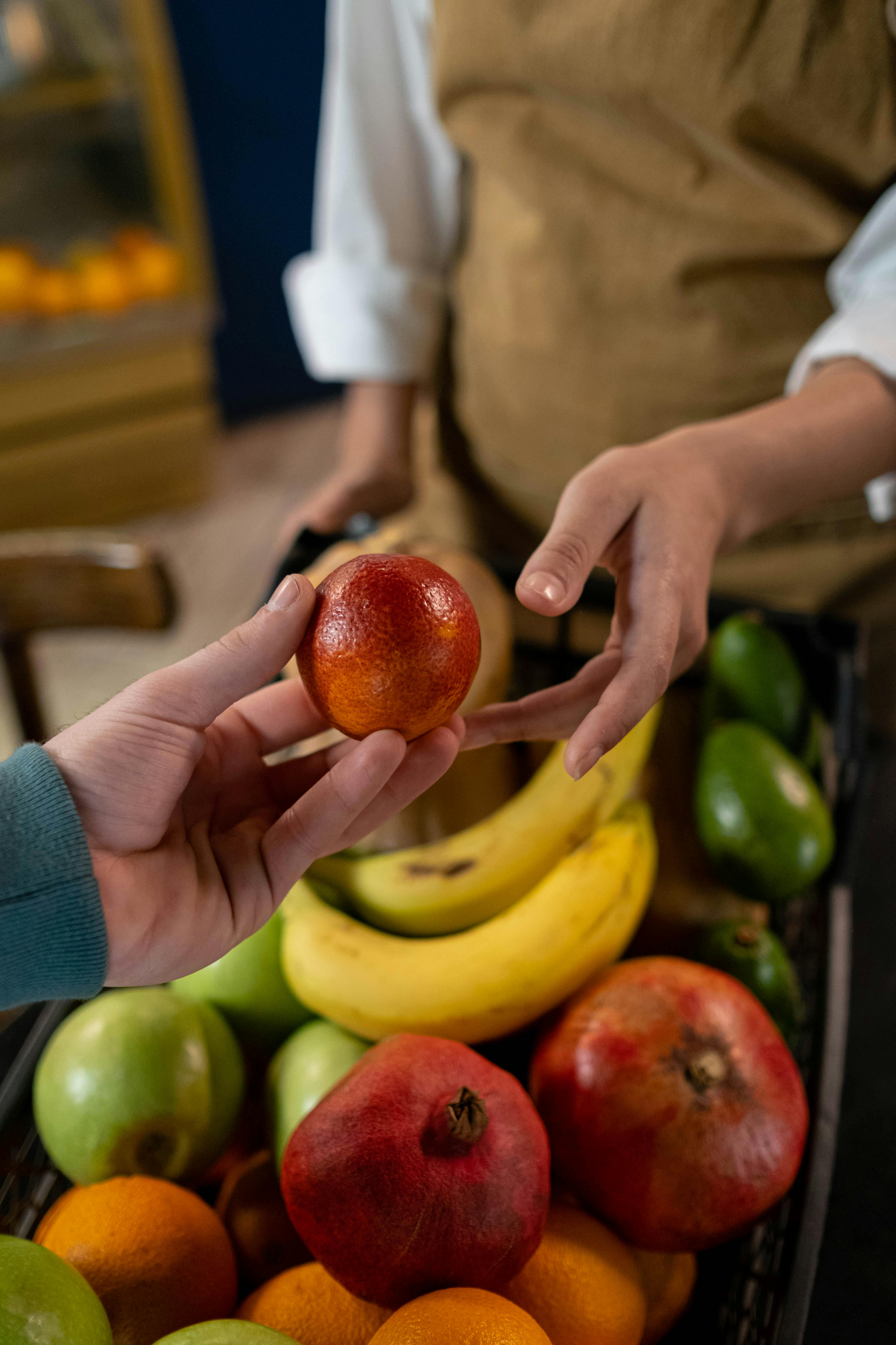 Person Handing Over Red Apple Fruit · Free Stock Photo