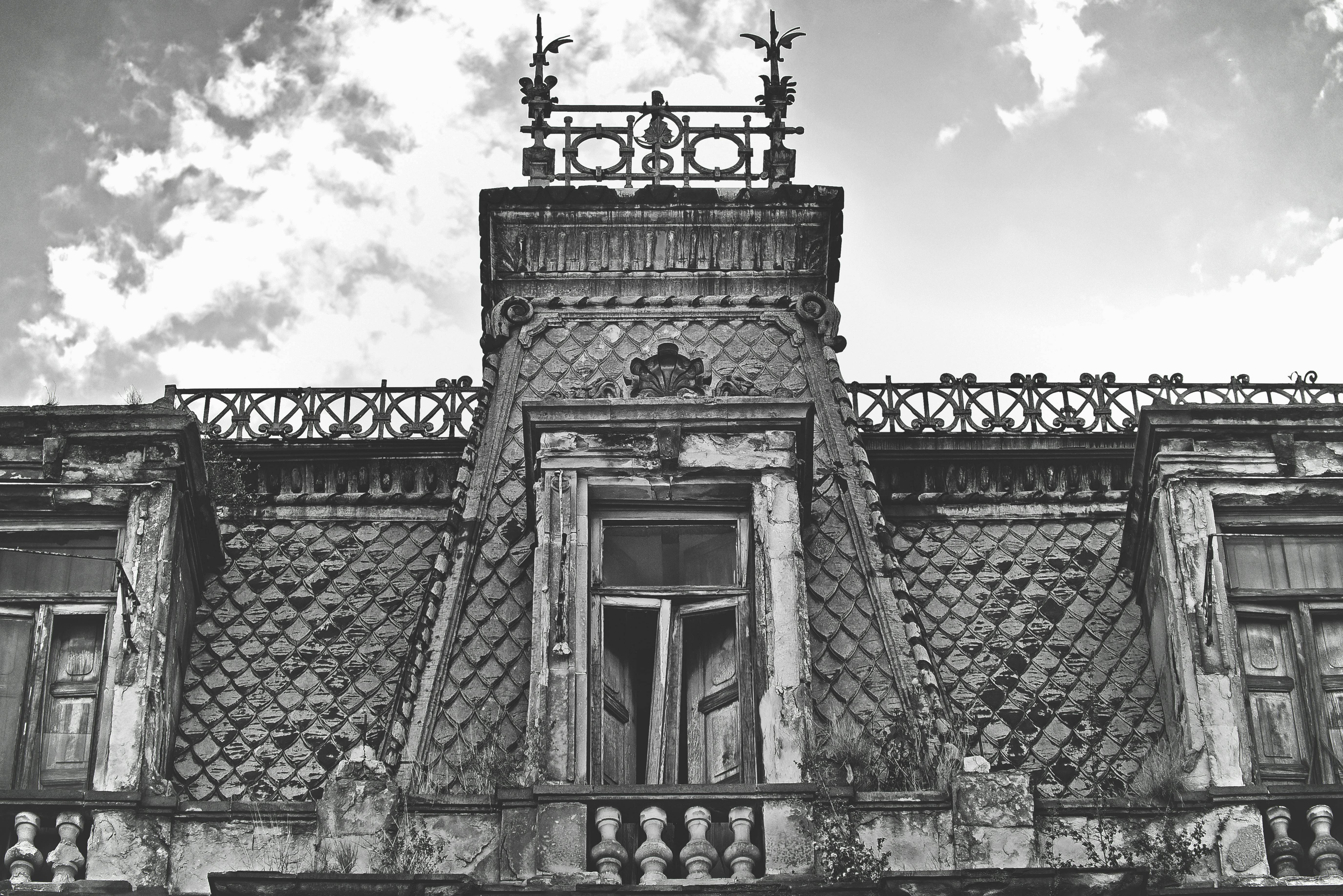 Grayscale Photo of a Derelict Building · Free Stock Photo