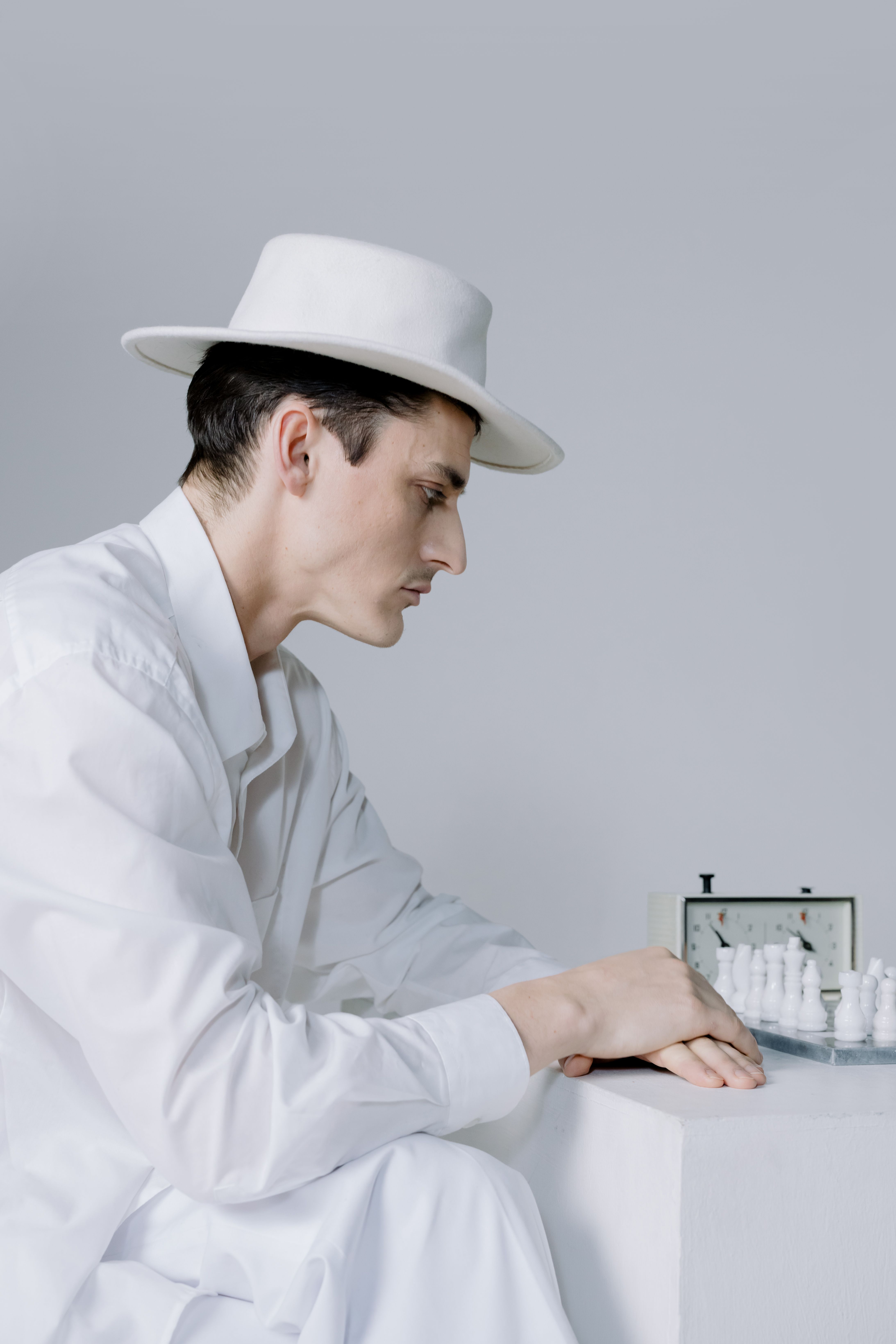Man in White Clothing and Hat · Free Stock Photo