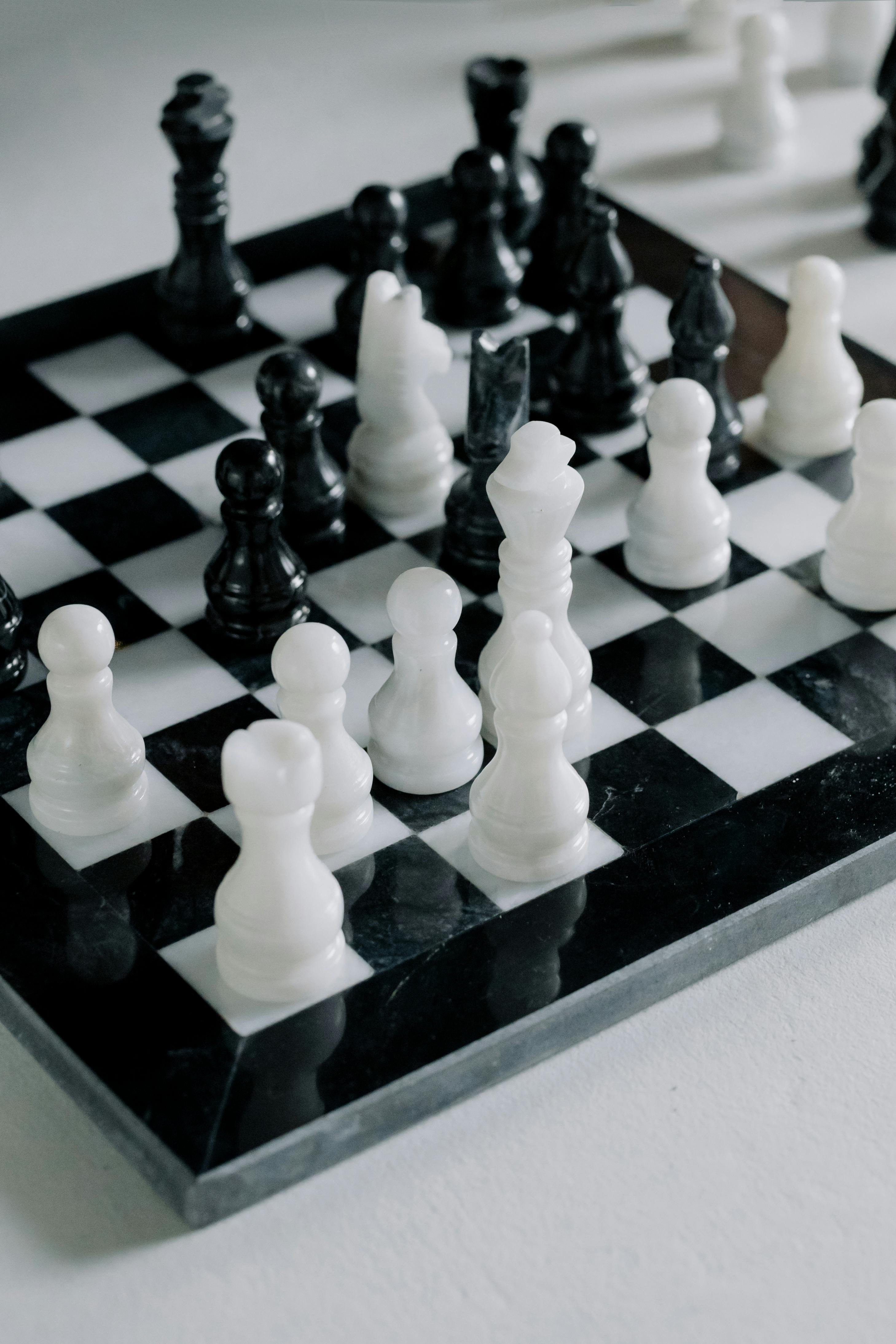 Grayscale Photo of Chess Pieces · Free Stock Photo