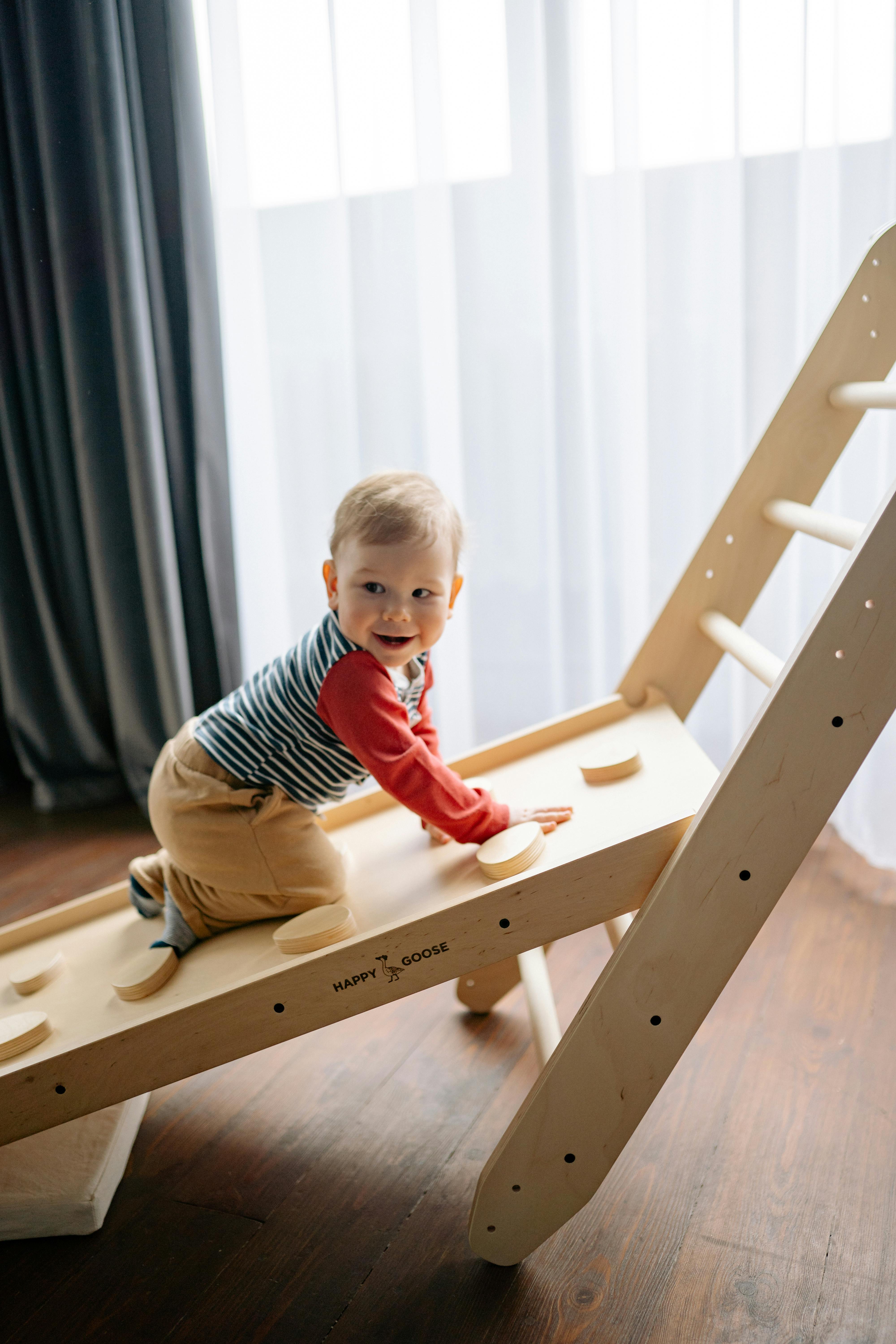 A Toddler on a Climbing Ramp · Free Stock Photo