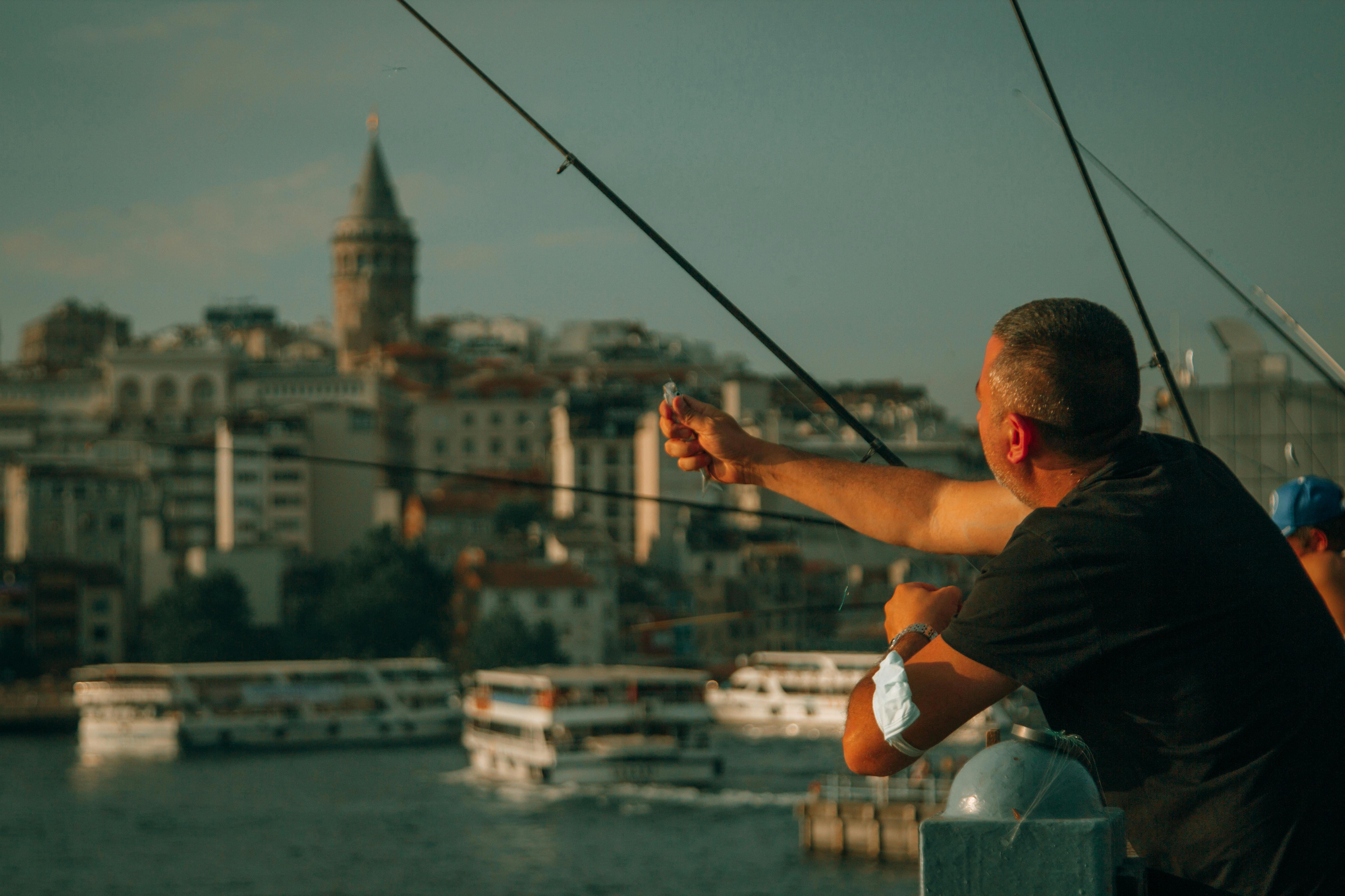 Man Catching a Fish · Free Stock Photo