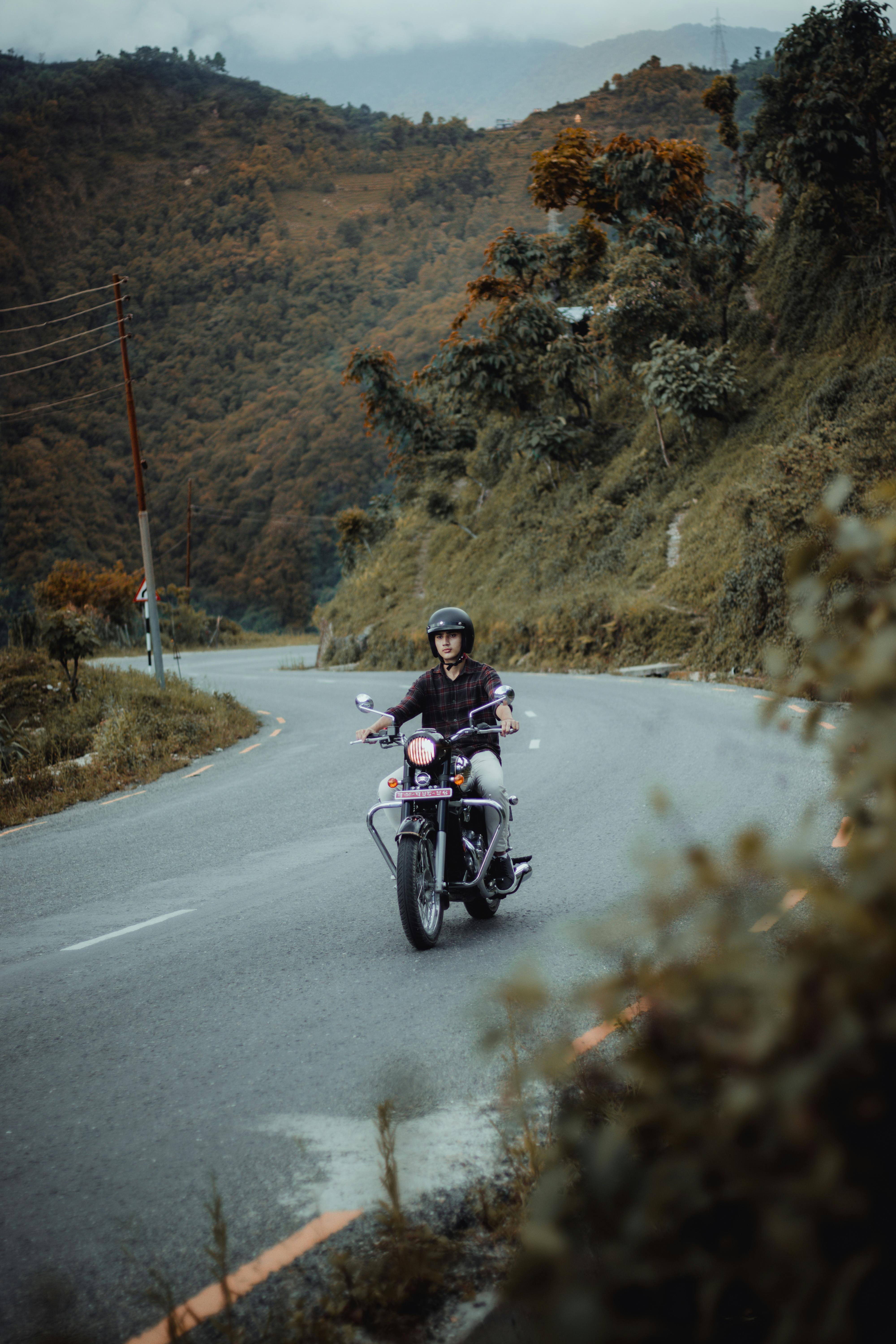 A Man Riding a Motorcycle · Free Stock Photo
